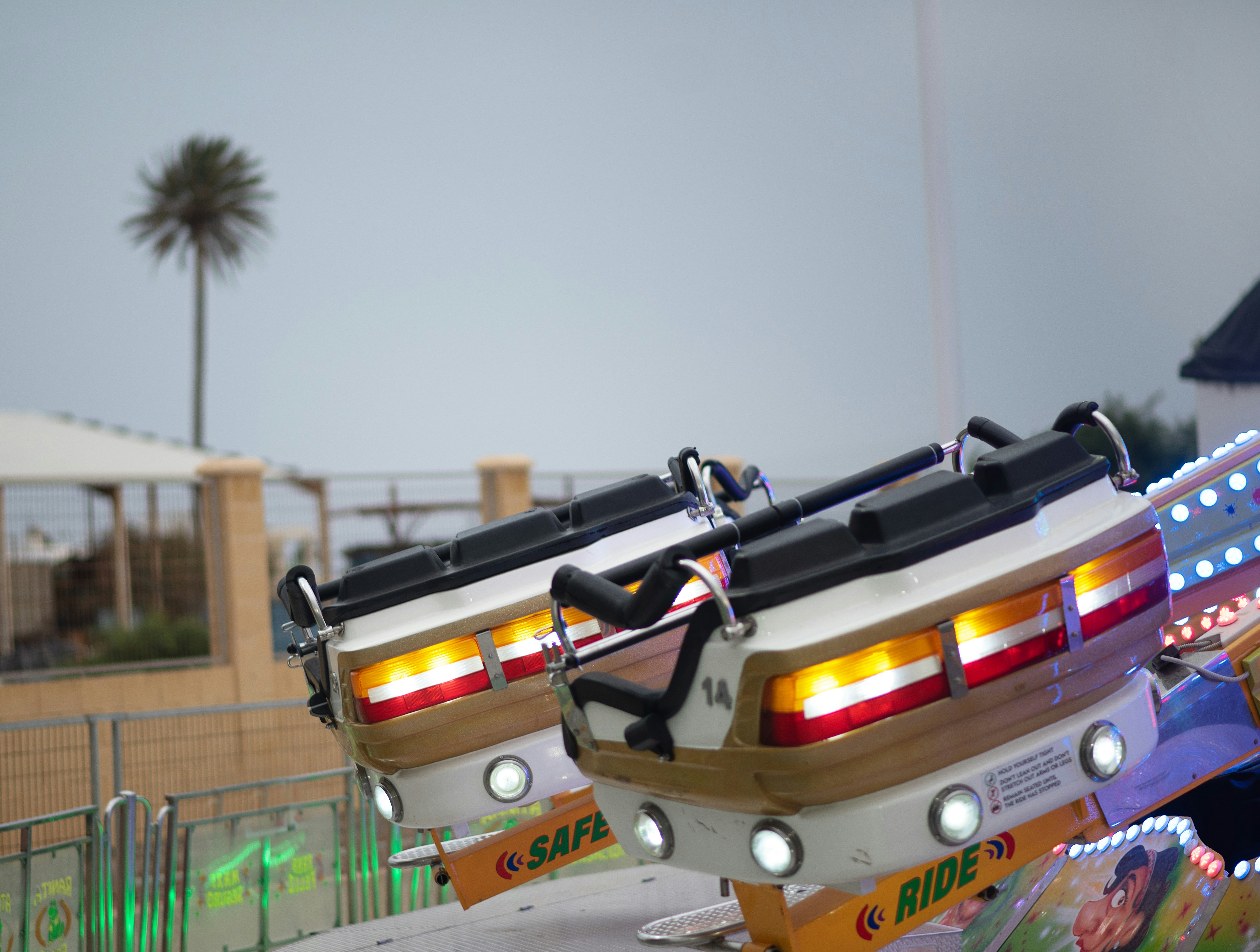 Tilted Ride Carriages at Sunset Fairground