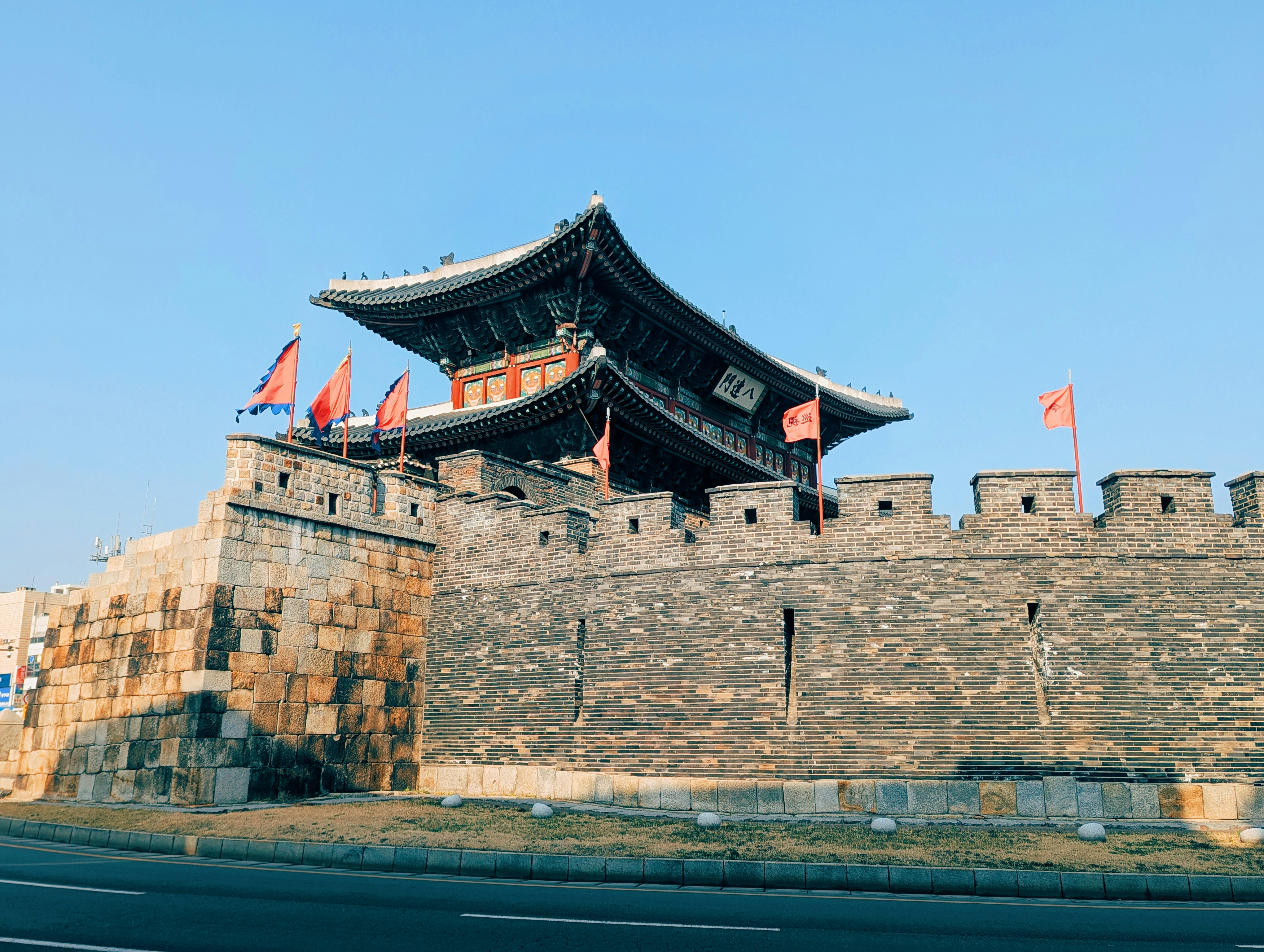 Fortress Crest: The Multi-Tiered Gatehouse under Blue Sky