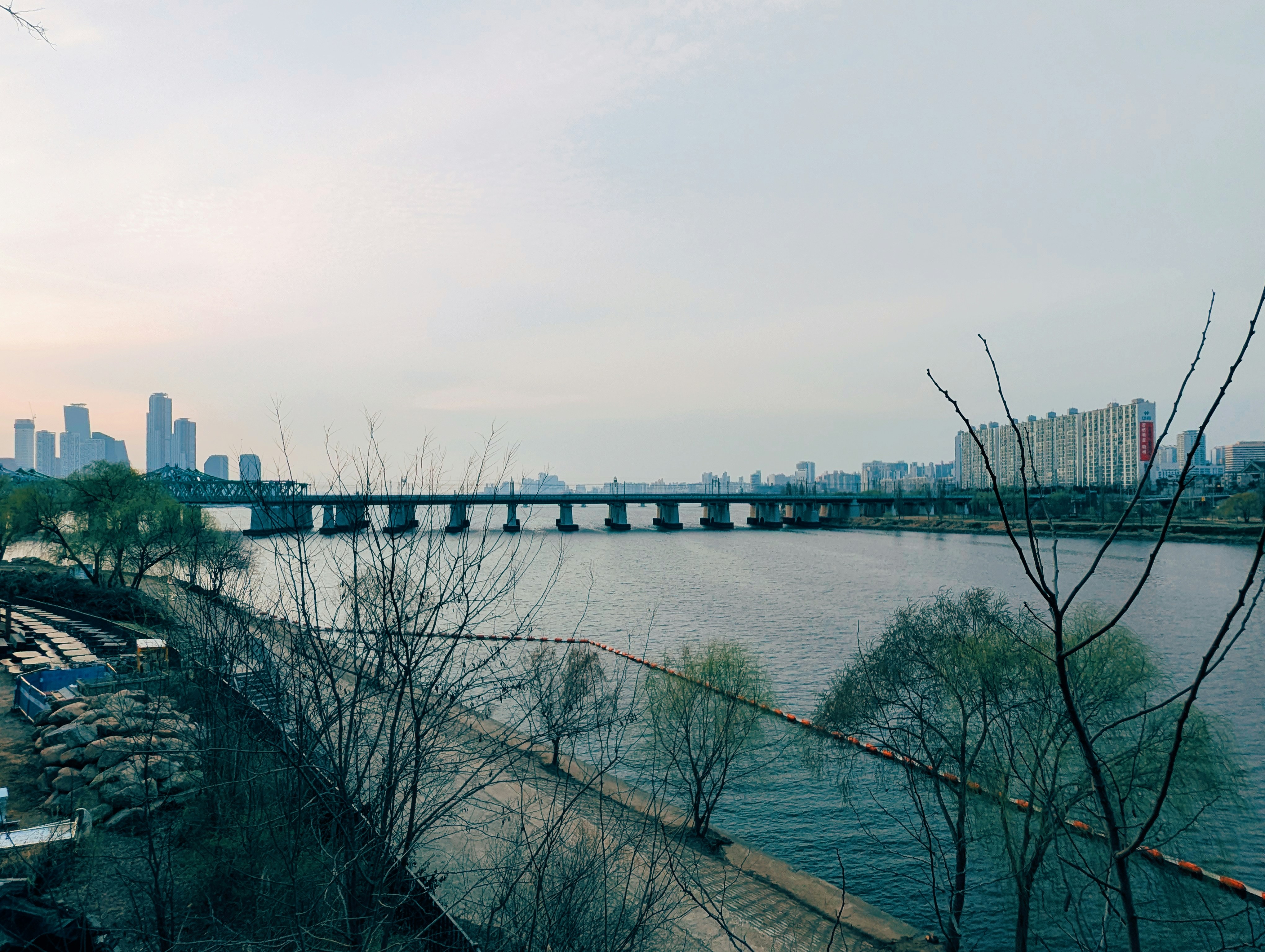 City skyline and bridge over a wide river photo – Free Travel Image on ...