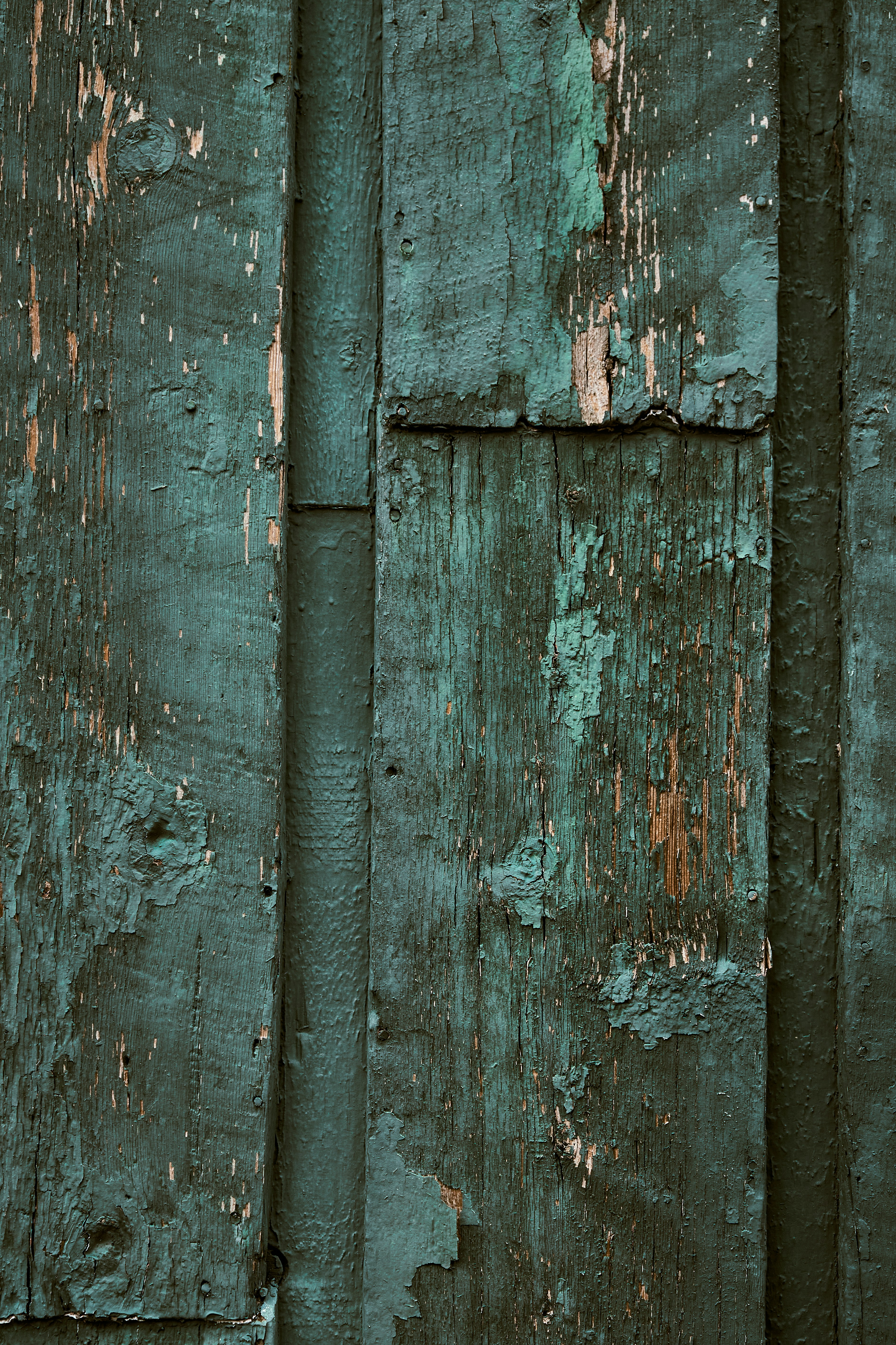 Weathered Teal Wood Panels with Peeling Paint and Grain Texture