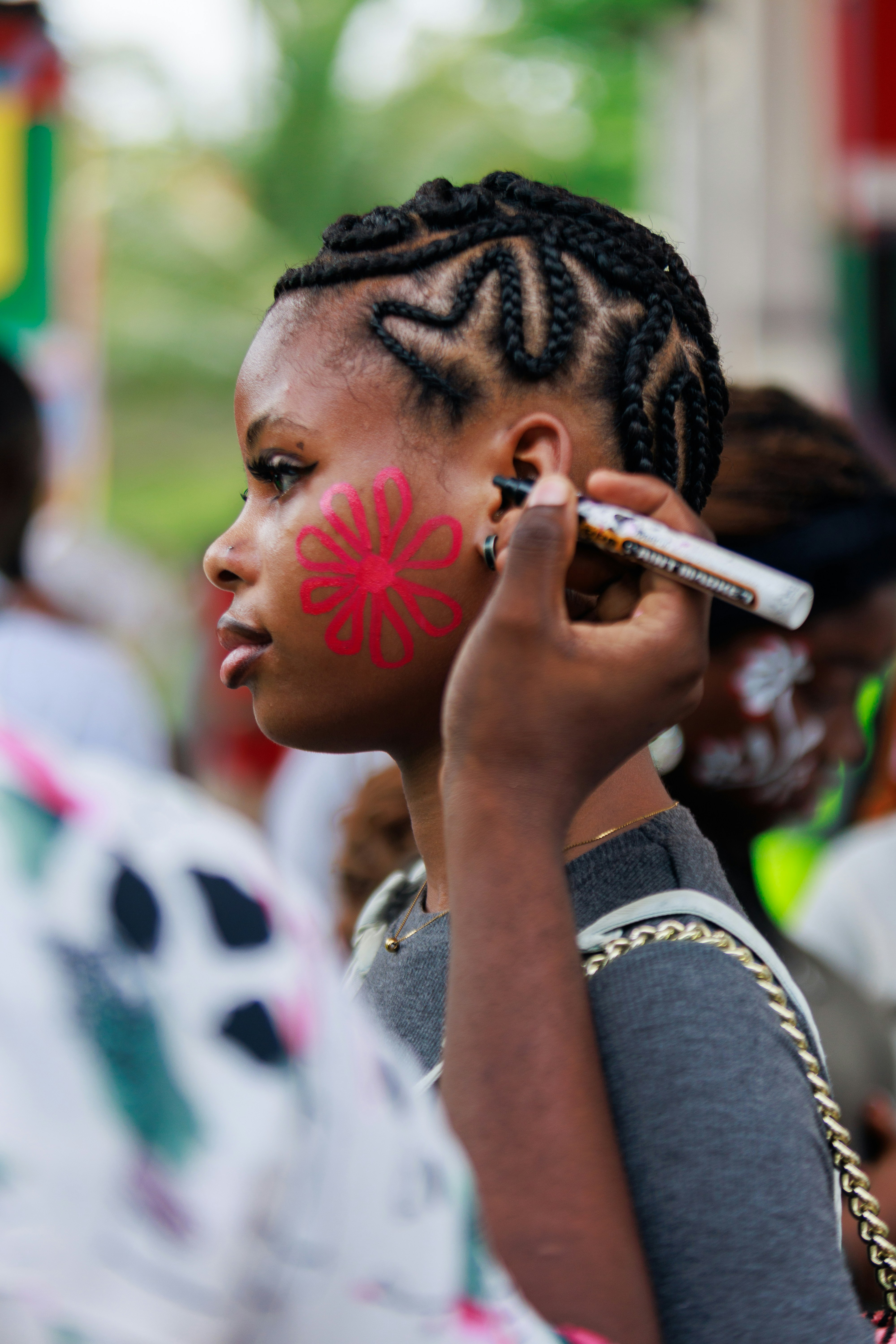 Face paint bloom: a flower of color on a side-profile