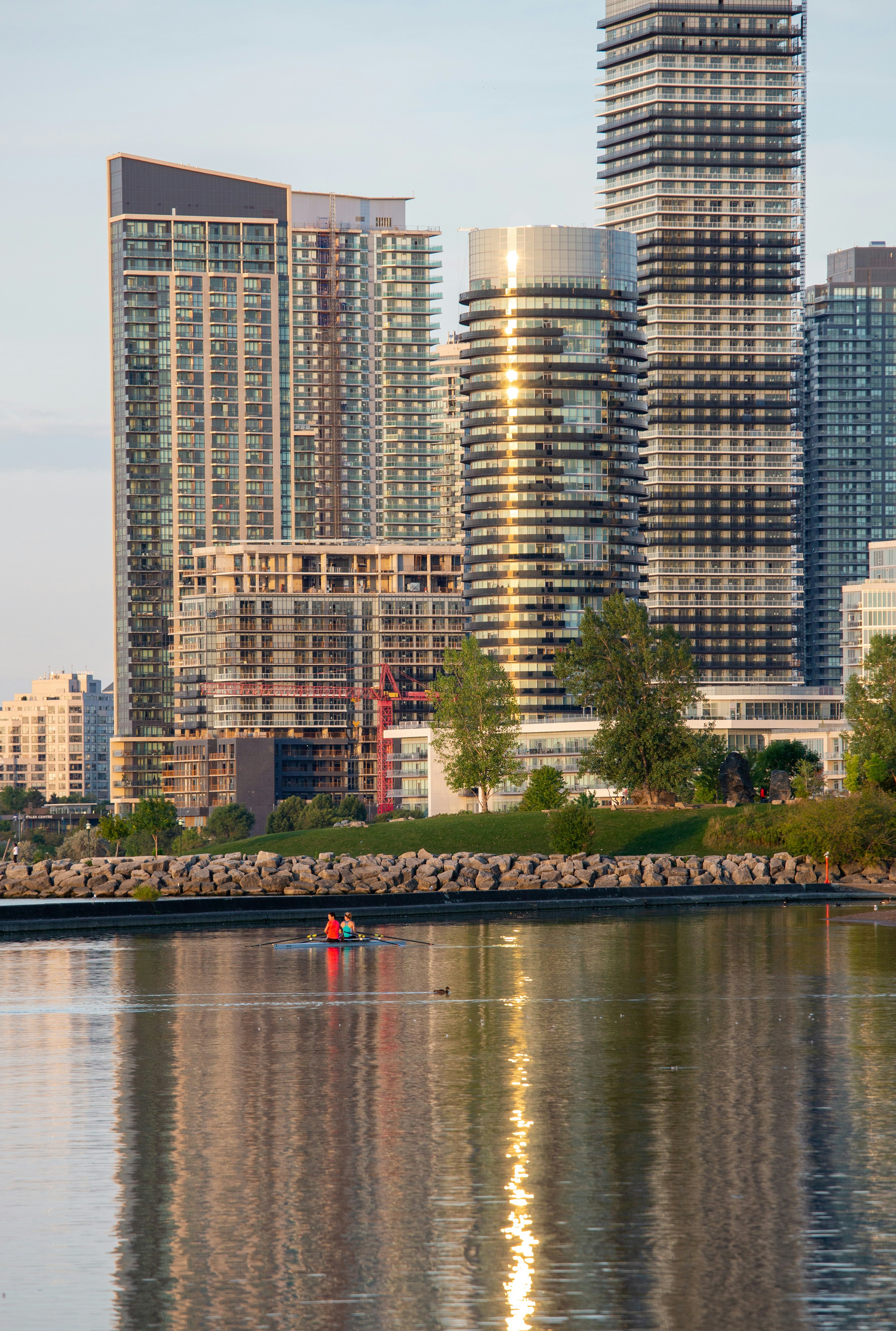 City Reflections: Golden Glint on Glass Towers by the Waterfront