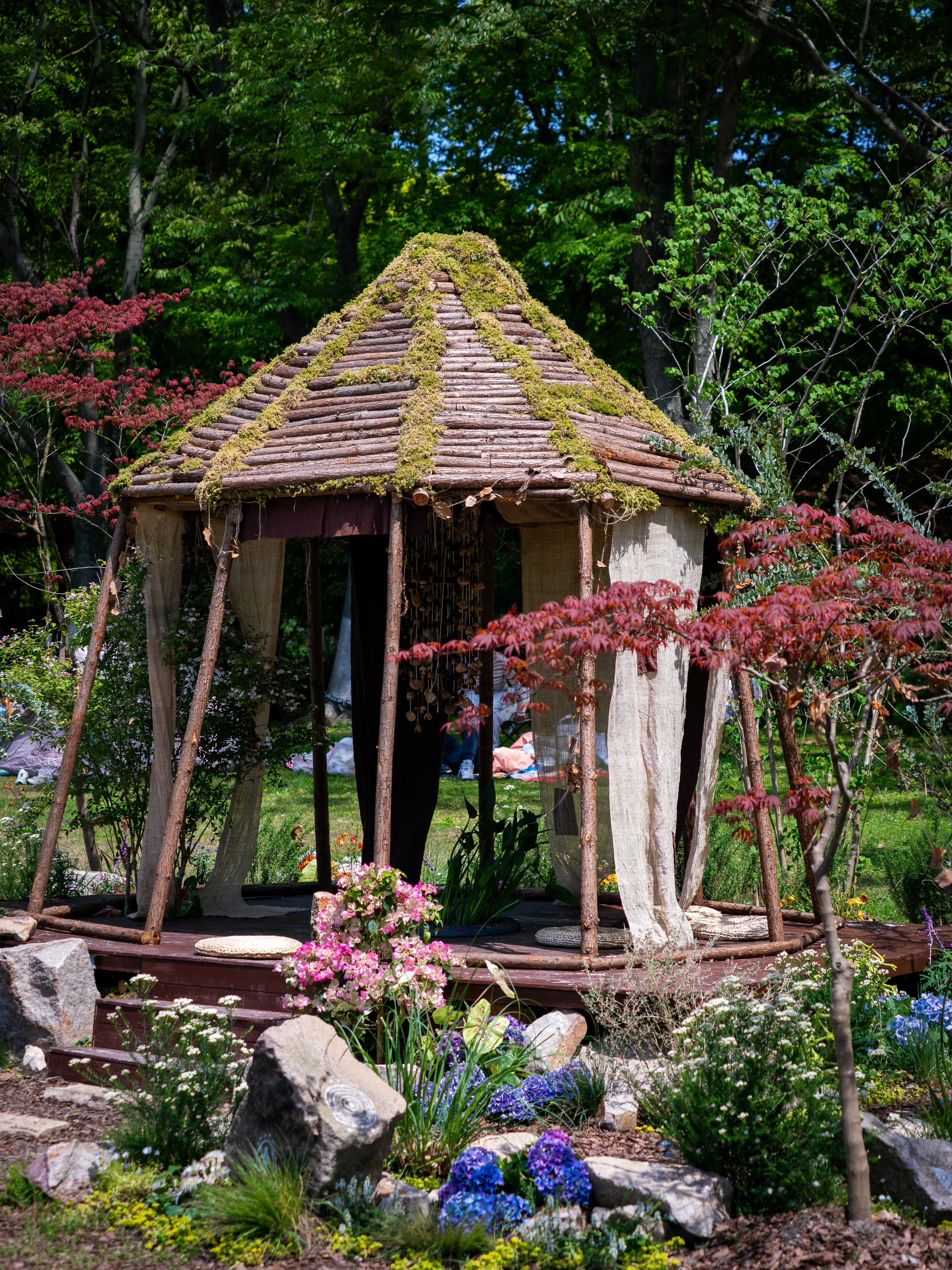Sunlit Mosaic Gazebo in a Blossoming Garden