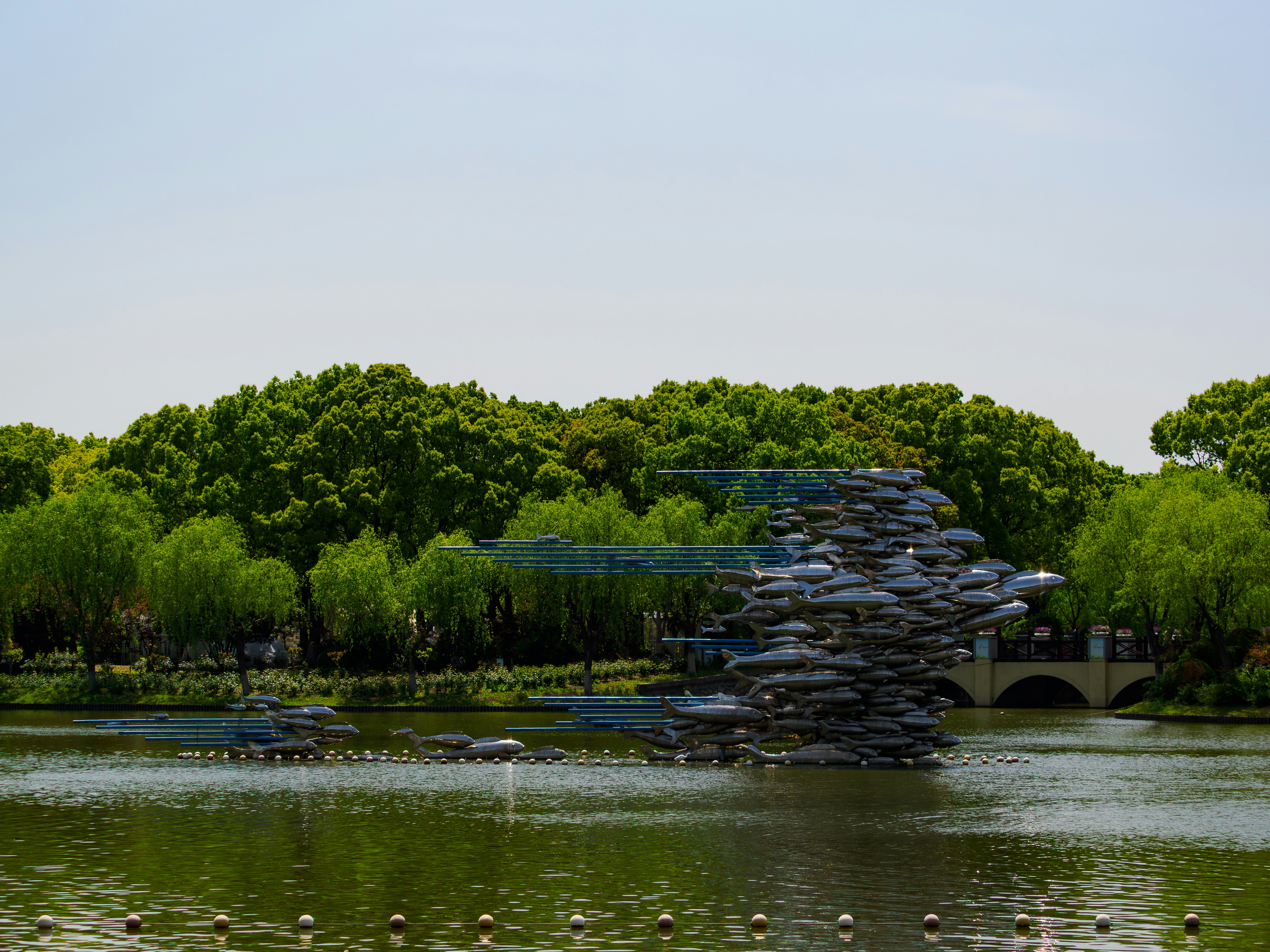 Floating Iron: A Quiet Stack of Shapes Rising from the Pond
