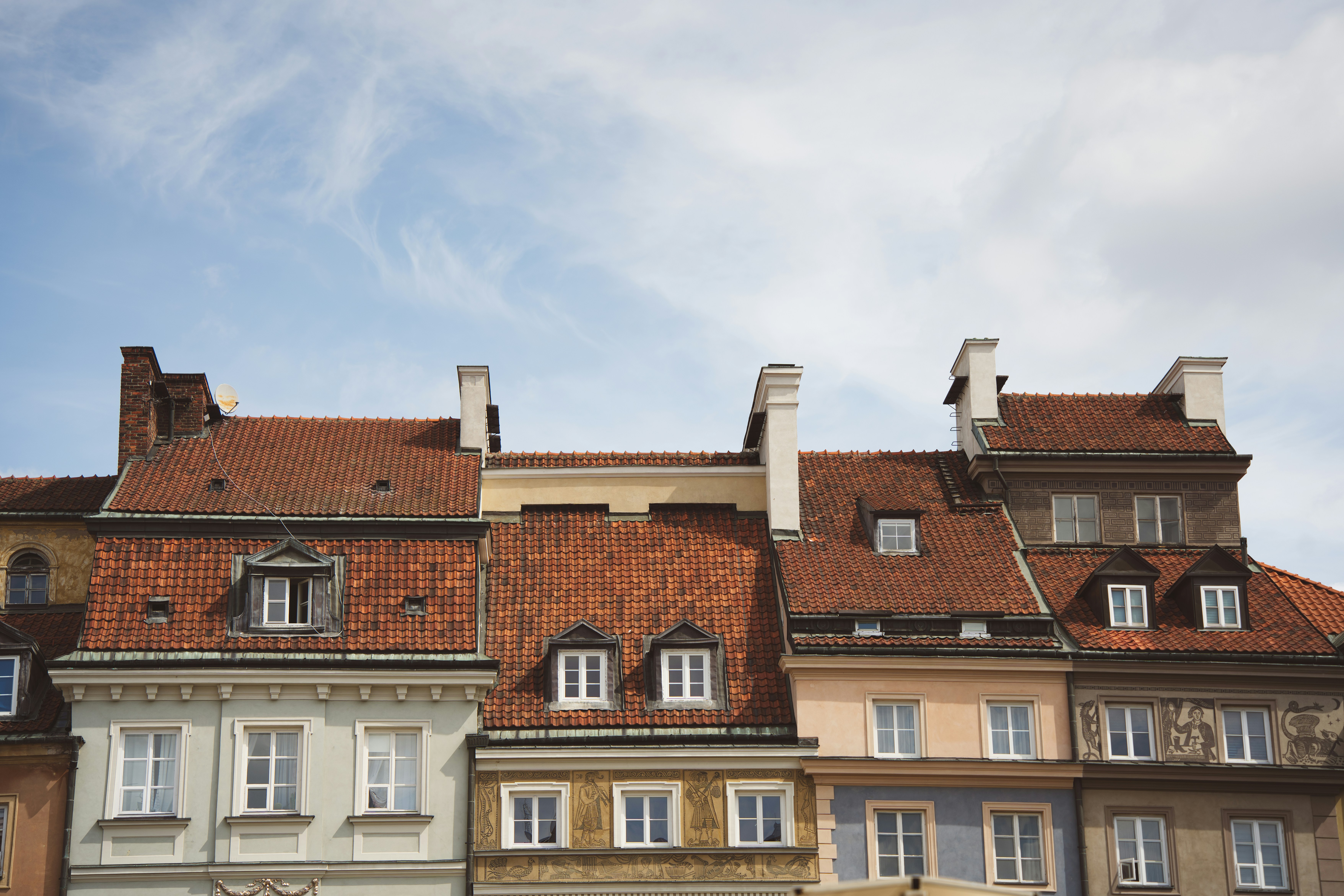 Row House Tapestry: Terracotta Roofs Beneath a Clear Sky