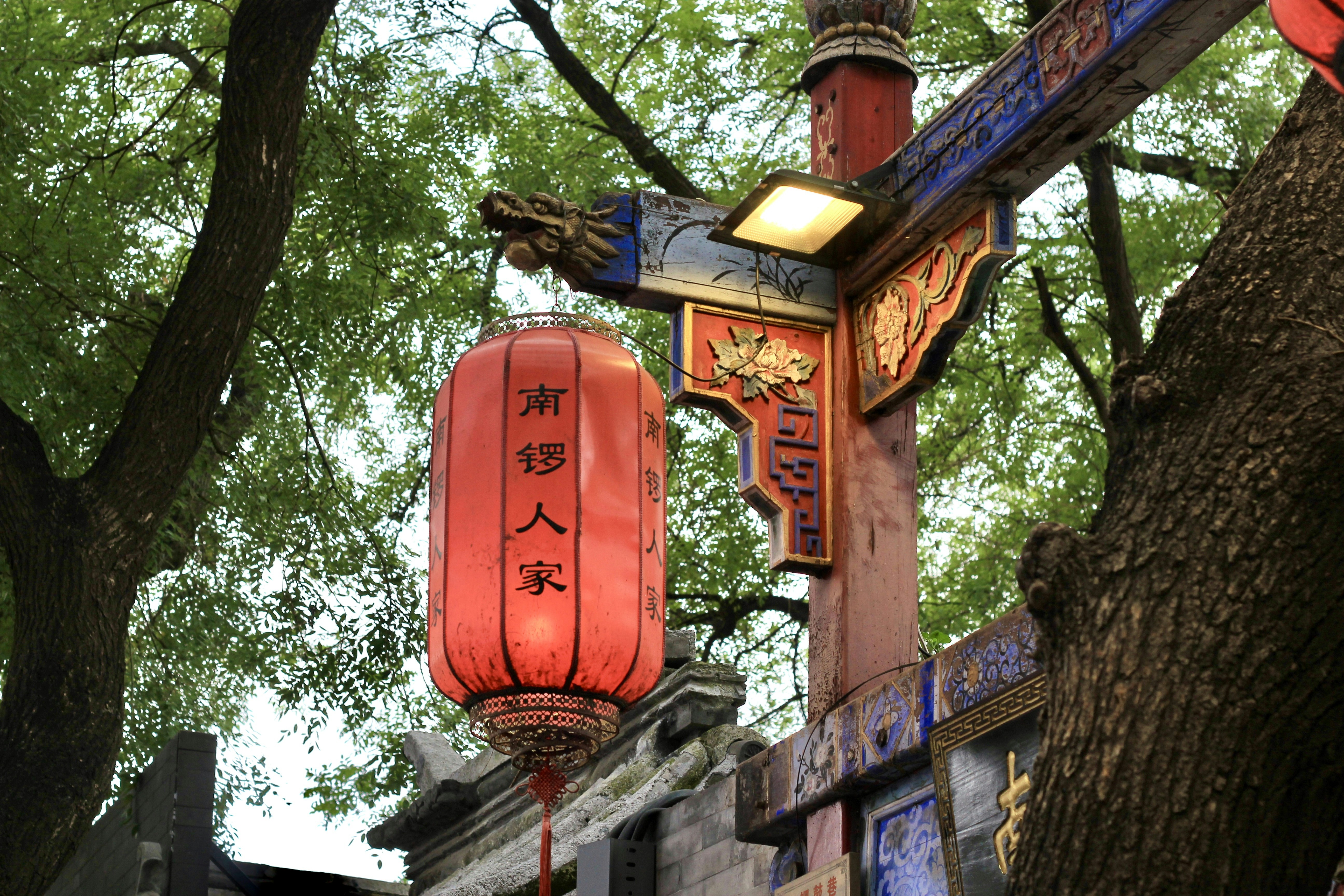 Red Lantern Amid Guardians of the Gate
