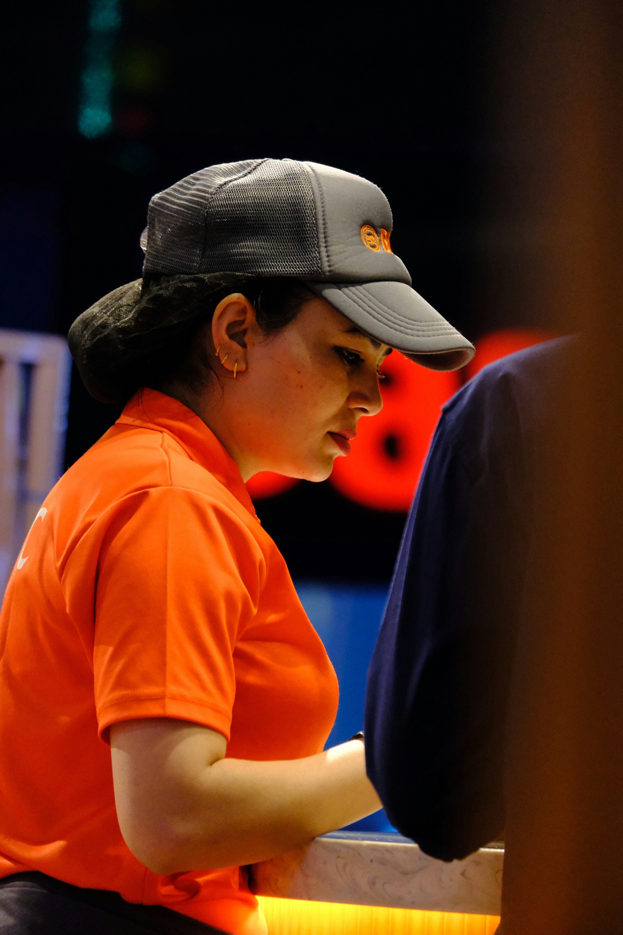 Portrait of Focus: A Candid Moment in Orange