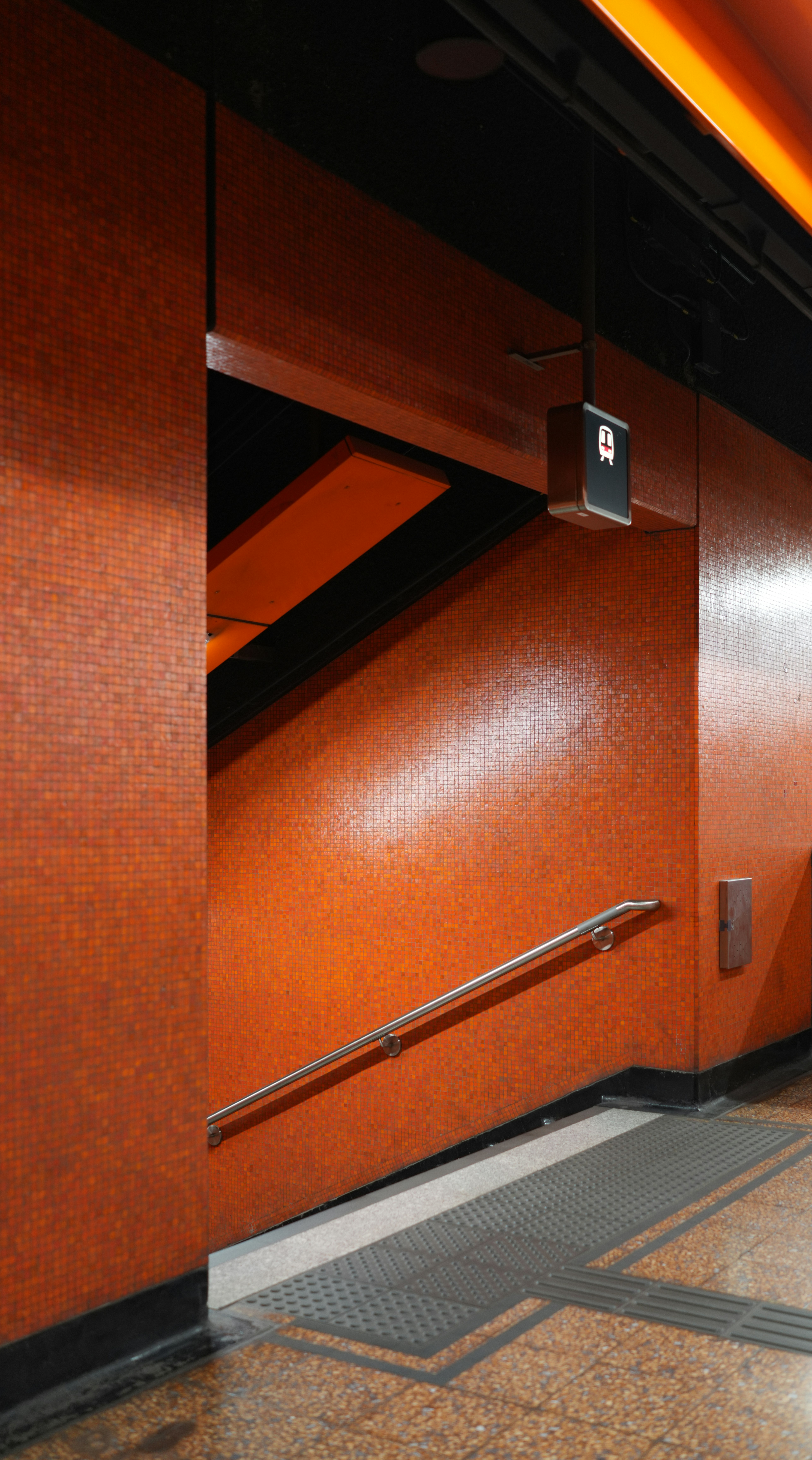 Tube Station Verona: Orange Tiles, Gentle Staircase Light