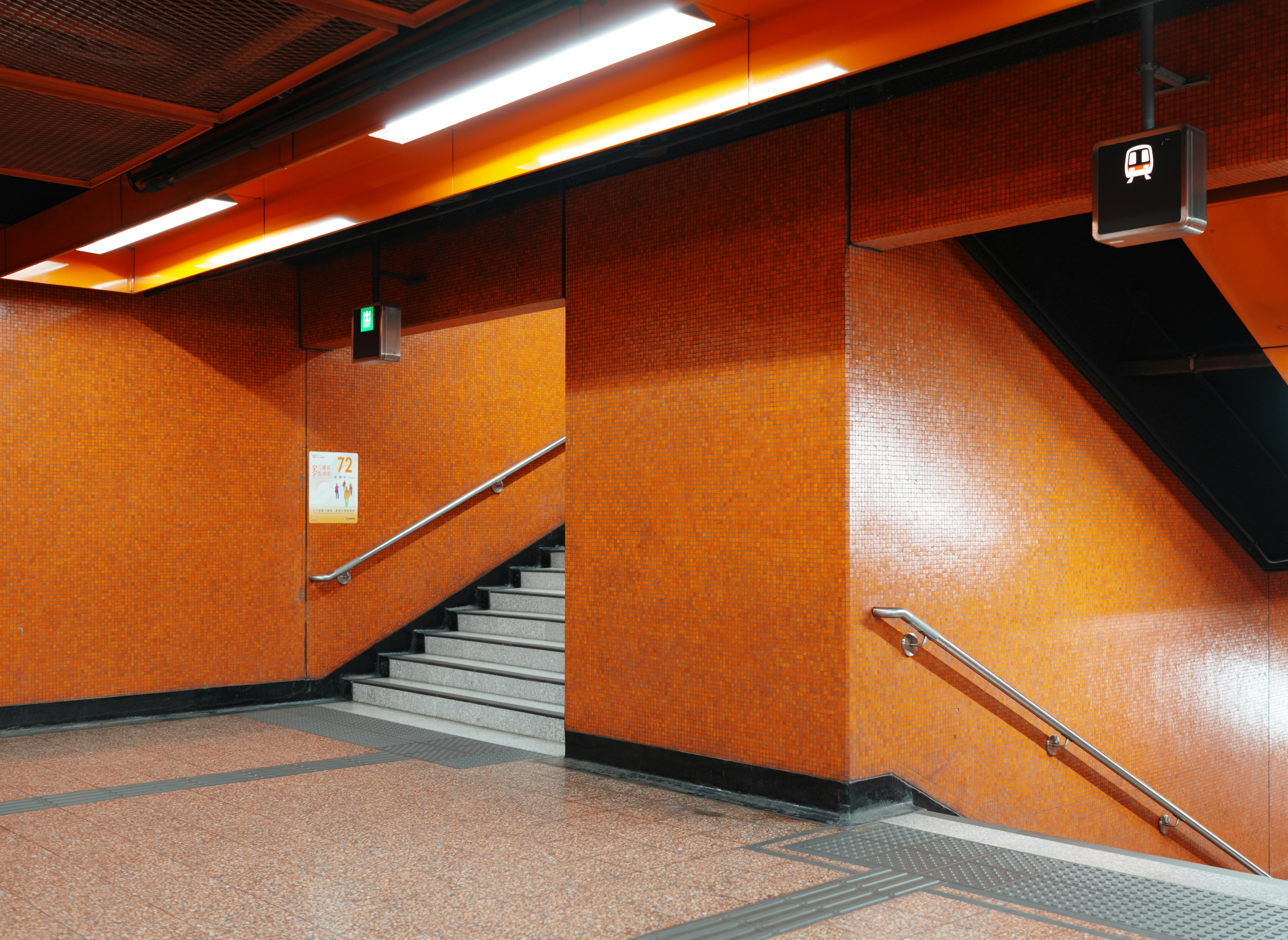 Orange Ascent: Subway Archways and Handrails