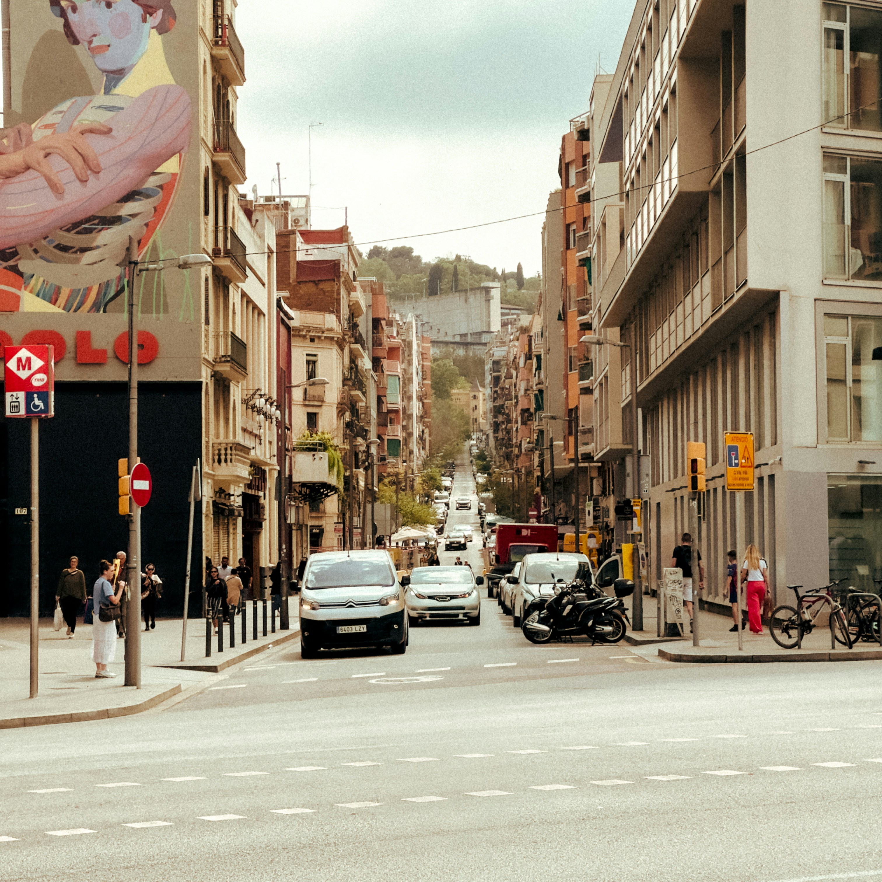 Urban Horizon: Cars and Street Fade into a Hilltop Avenue