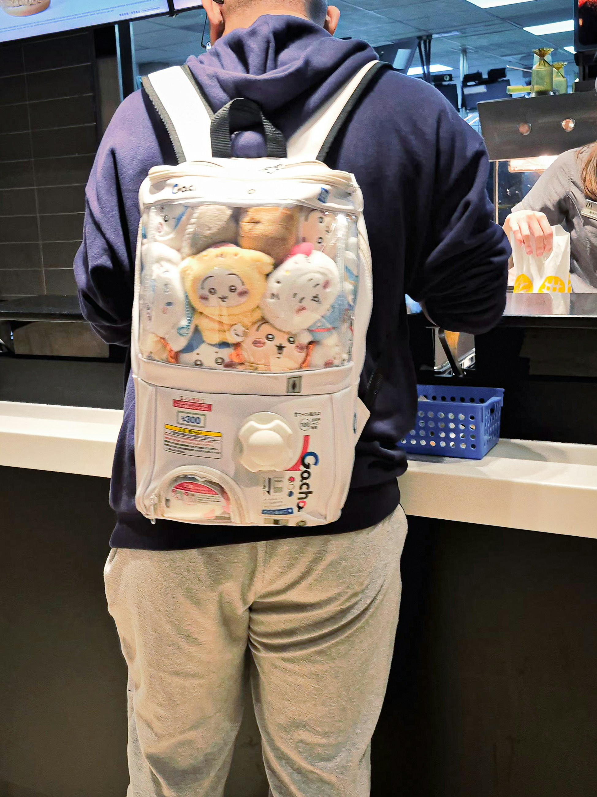Backpack of Plush Secrets: A Neon-Orange Adventure on the Counter