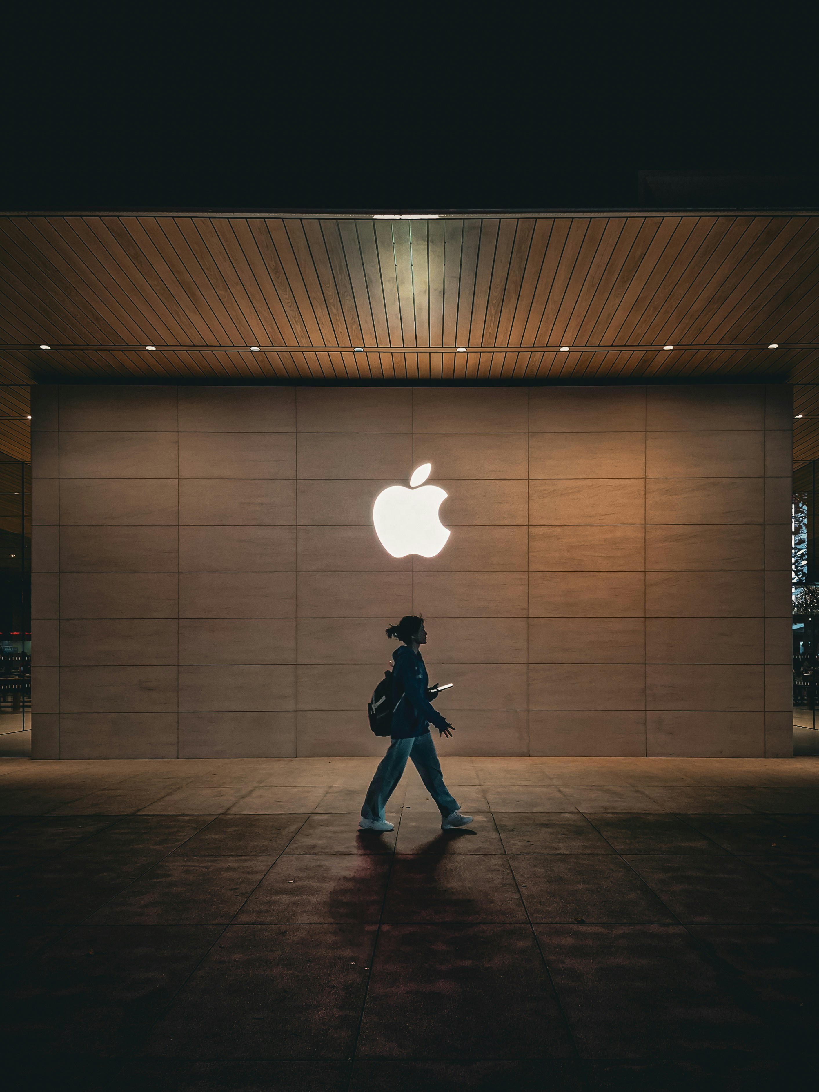 Silhouette Crossing the Apple Glow