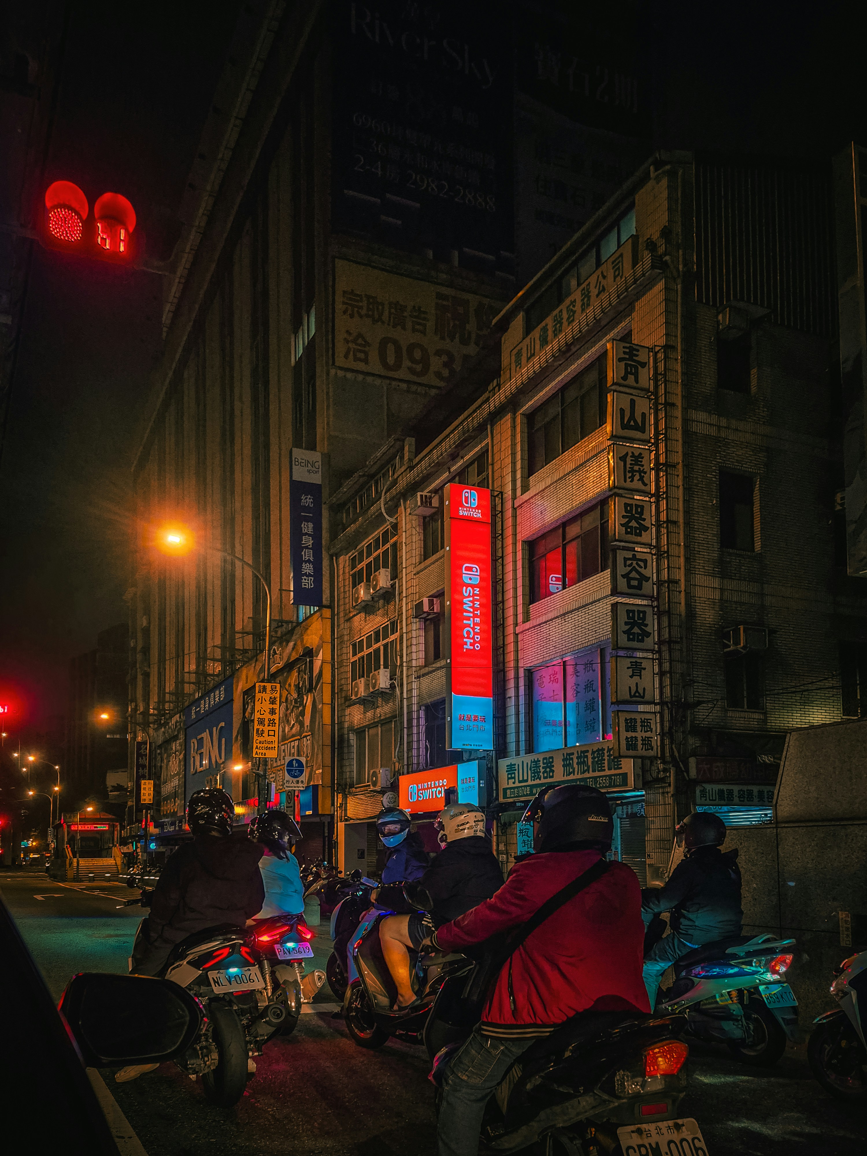 Neon Alley: Motorbikes and Signage in a Night Street Scene