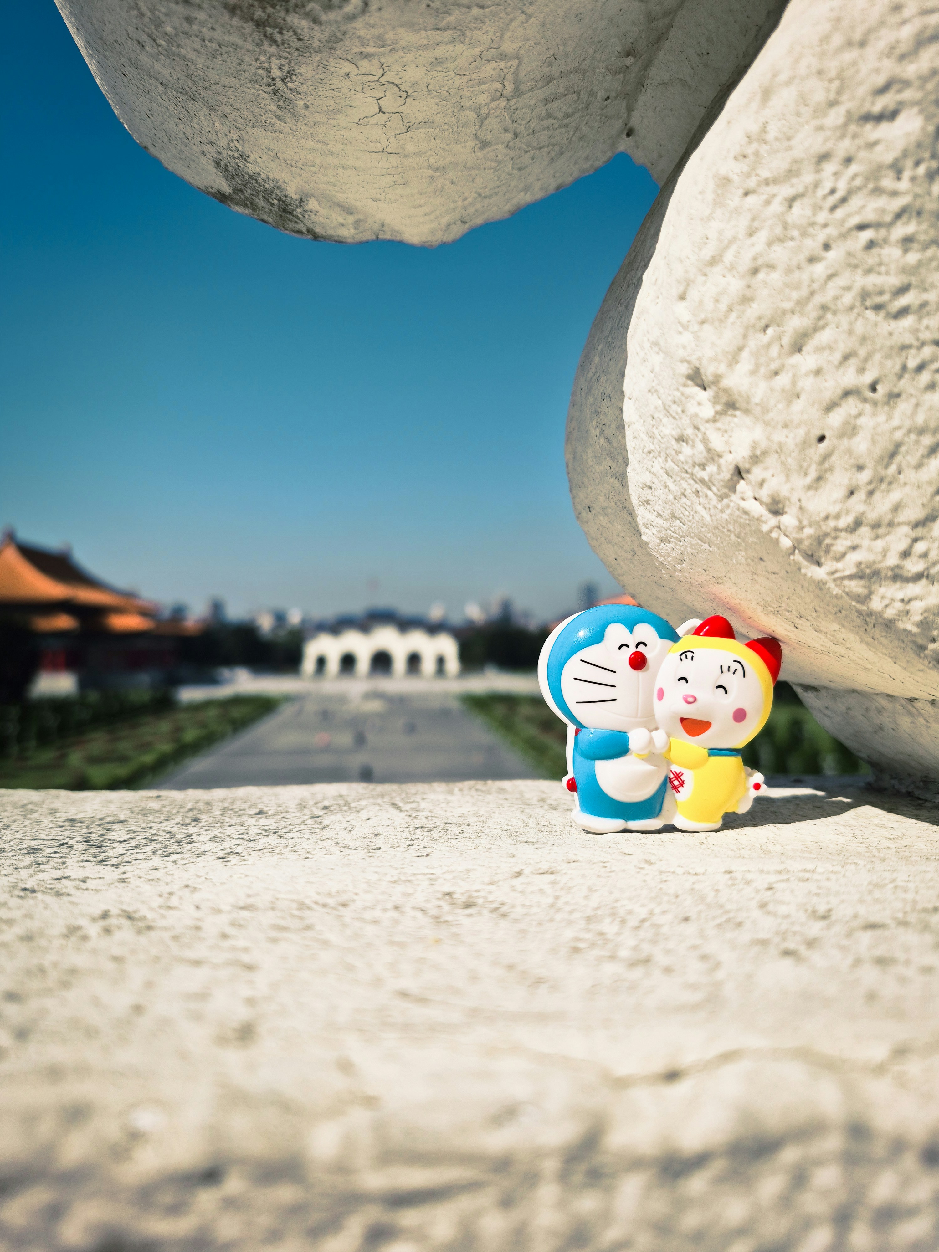 Cheerful Figurines Frame the Ancient Canopy