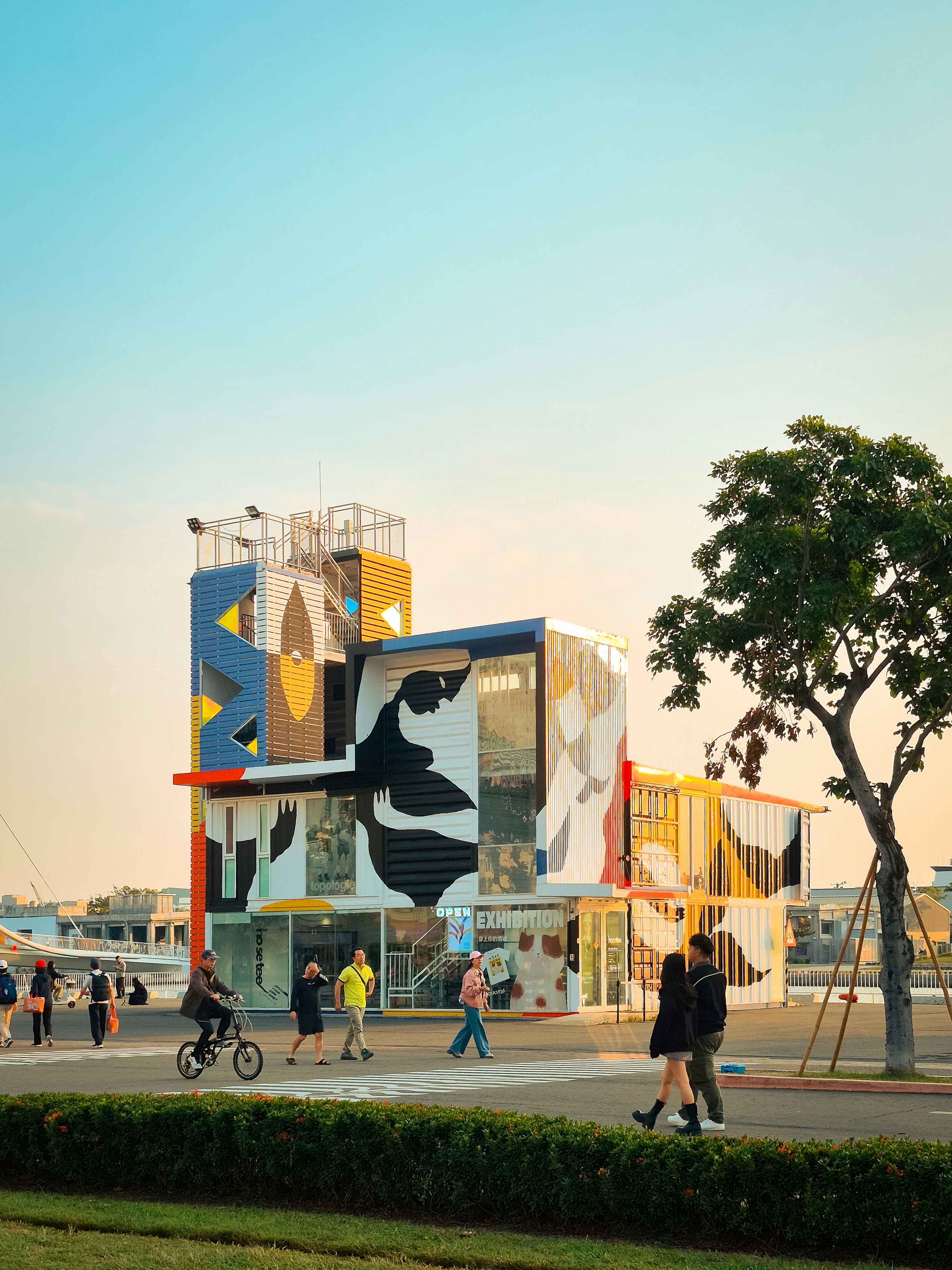 Colorful Exhibition Building Framed by Dappled Sunset Light