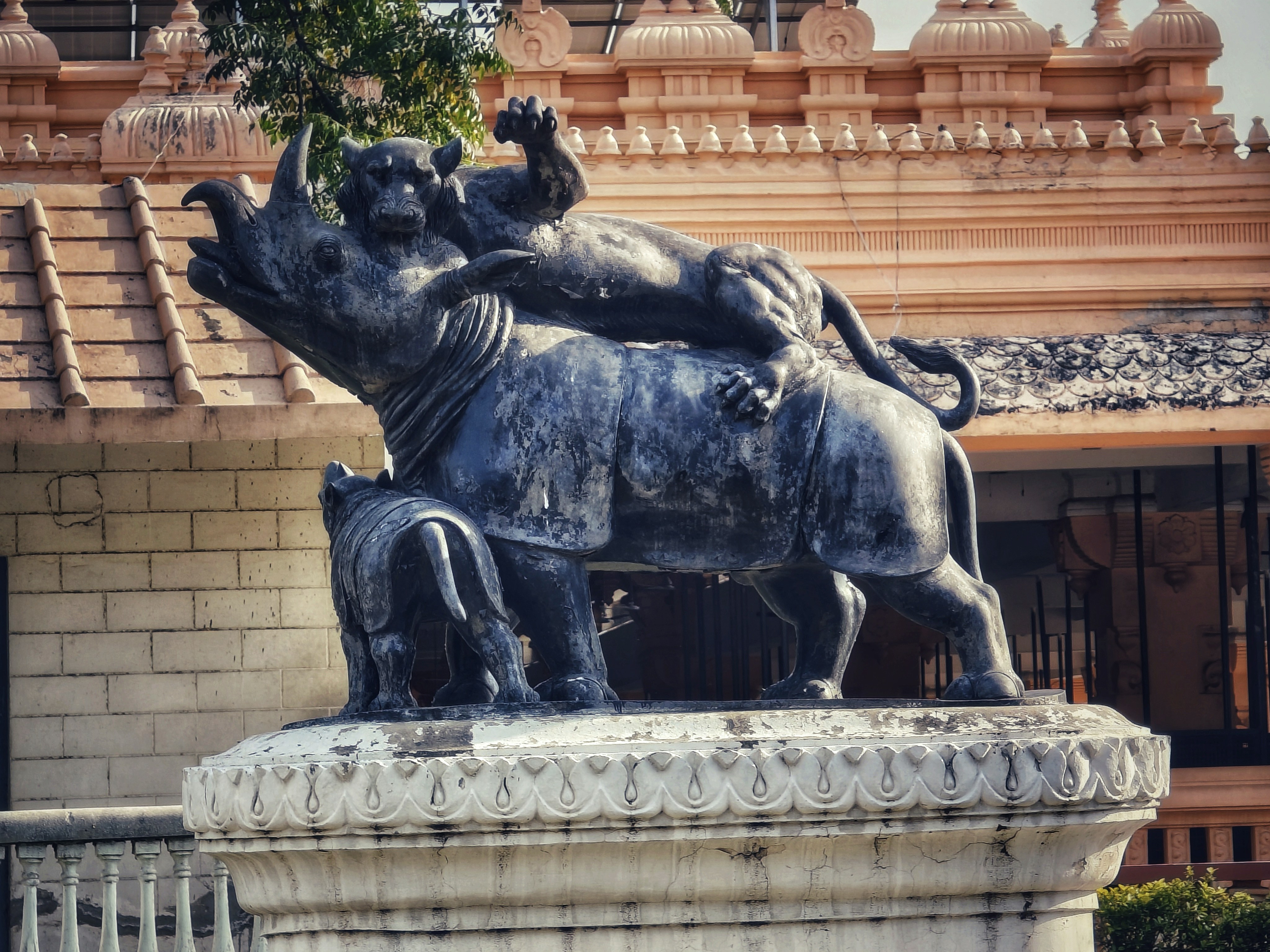 Guardian of Stone: A Straining Pose Under Classic Architecture