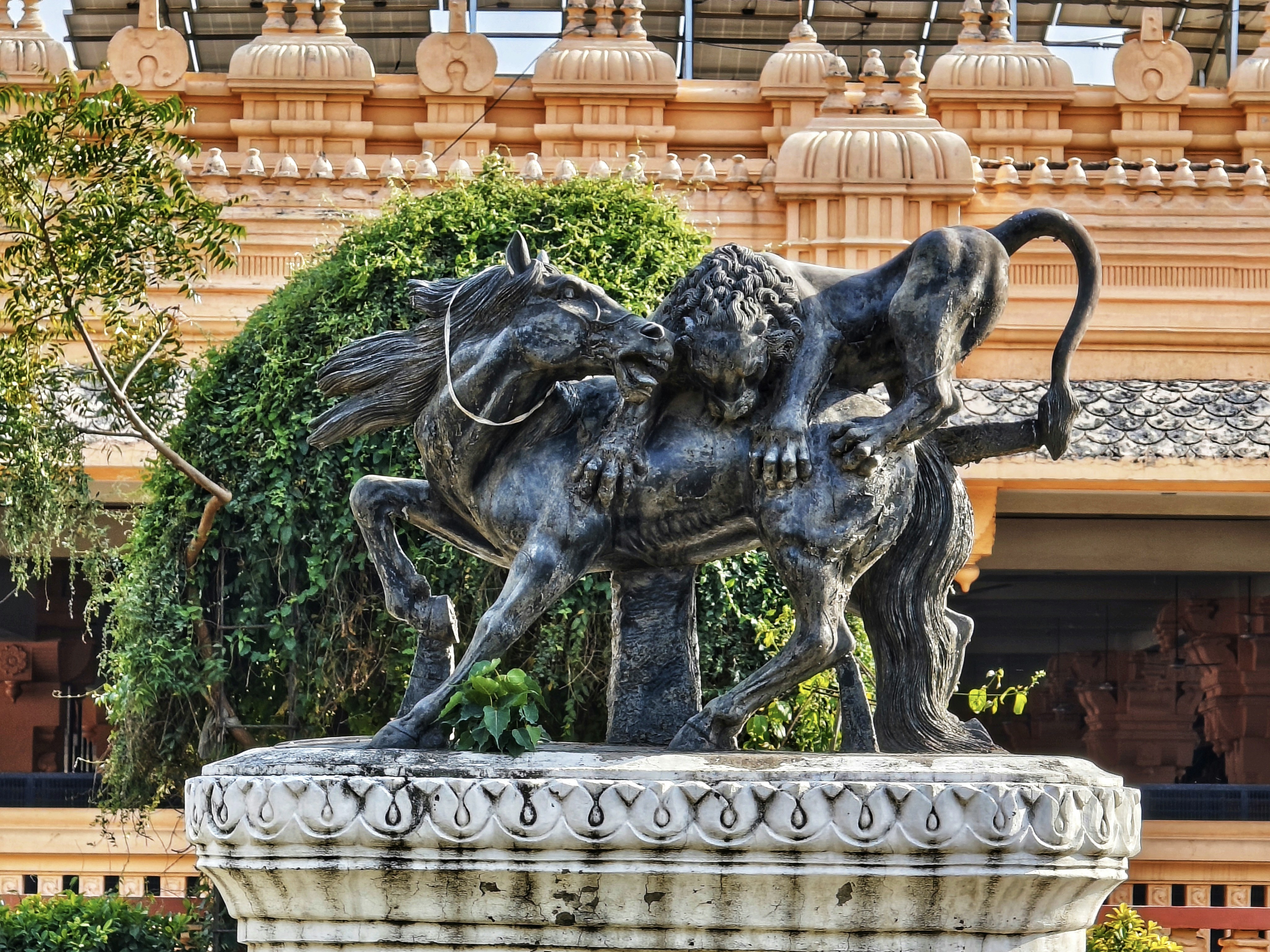 Bronzed Stallions in a Sunlit Courtyard