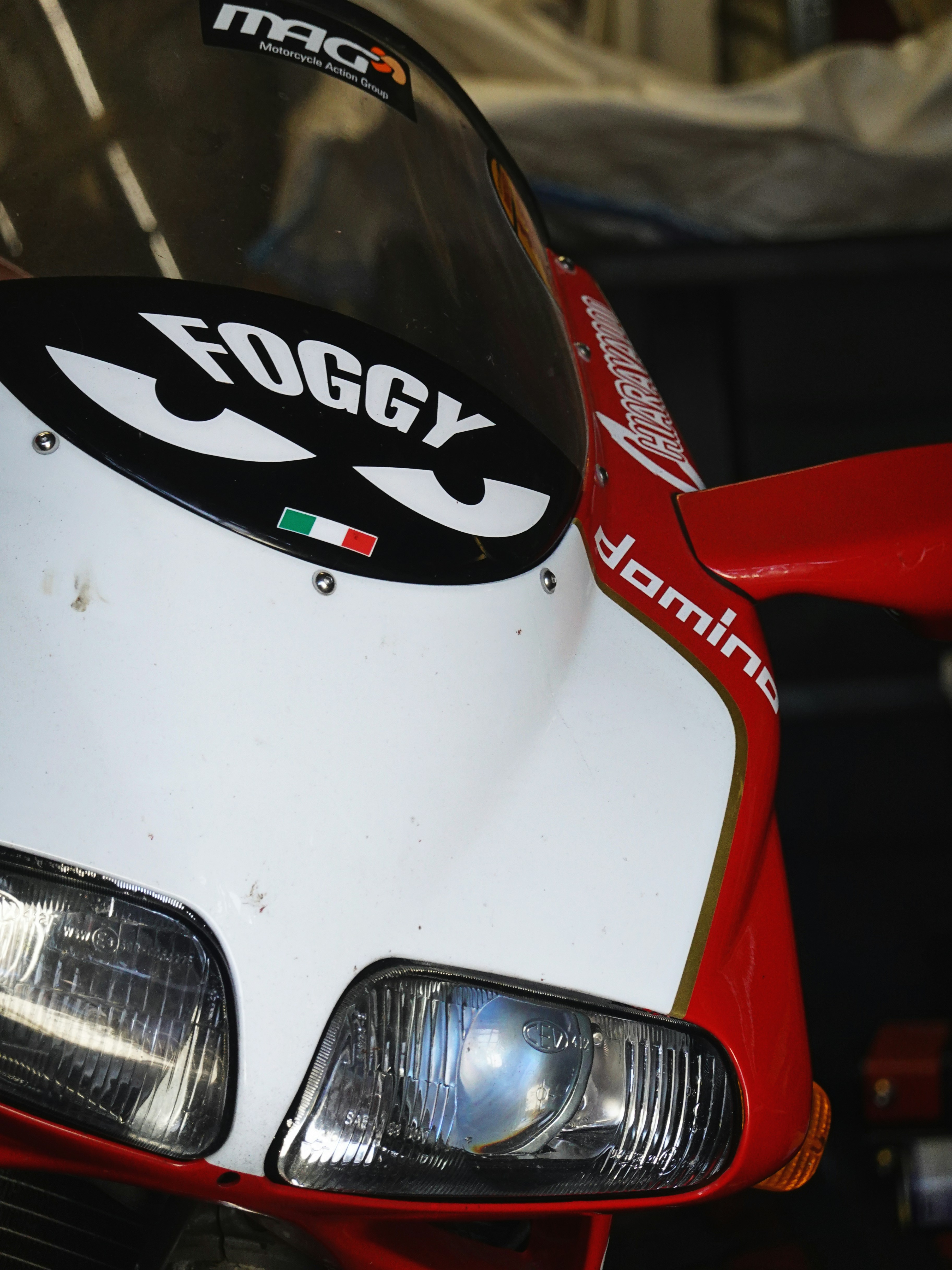Front Fairing of Foggy Racing Bike with Italian Tricolor Badge