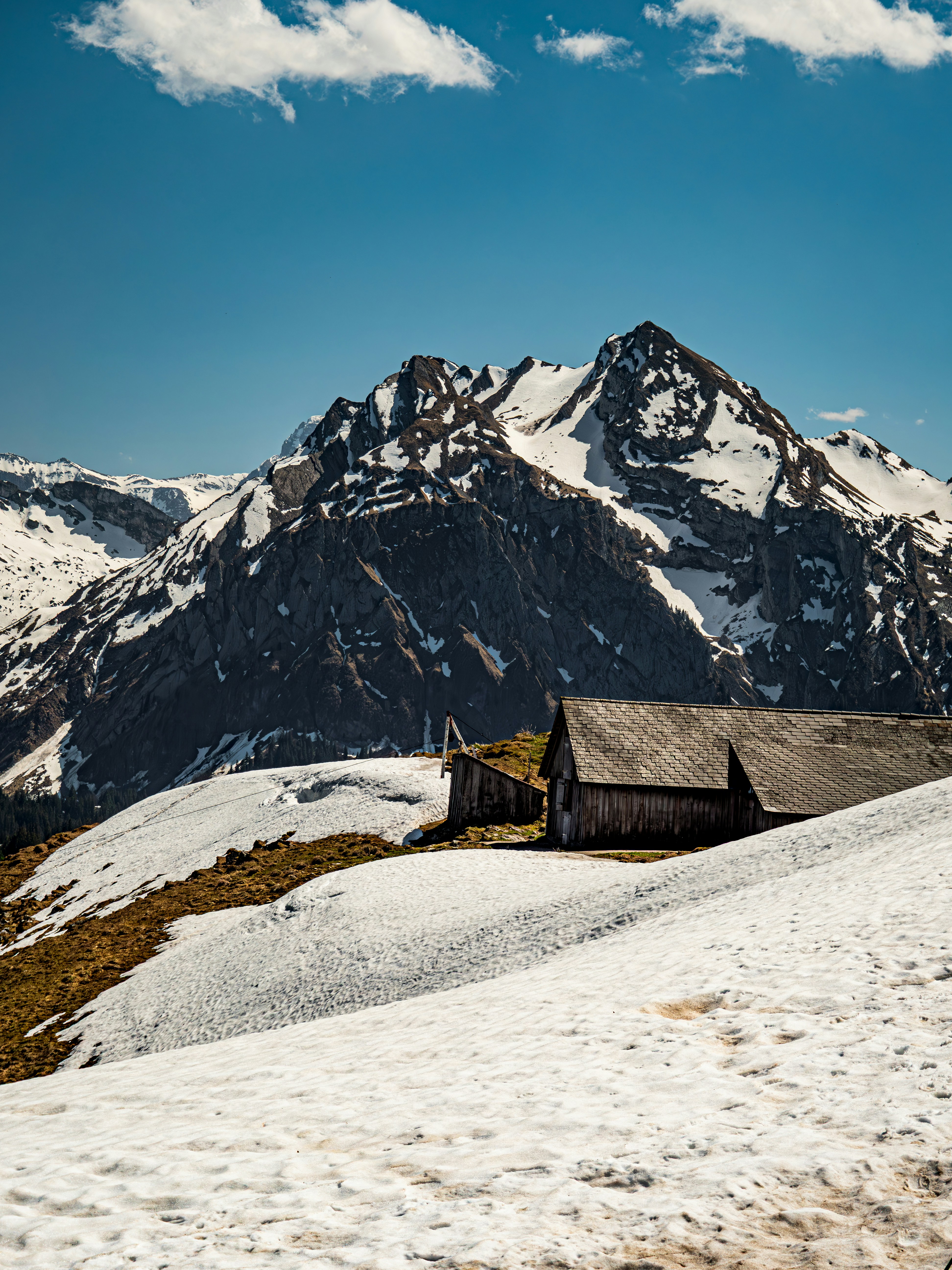 Snow-Scarred Ridge and Mountain Barn