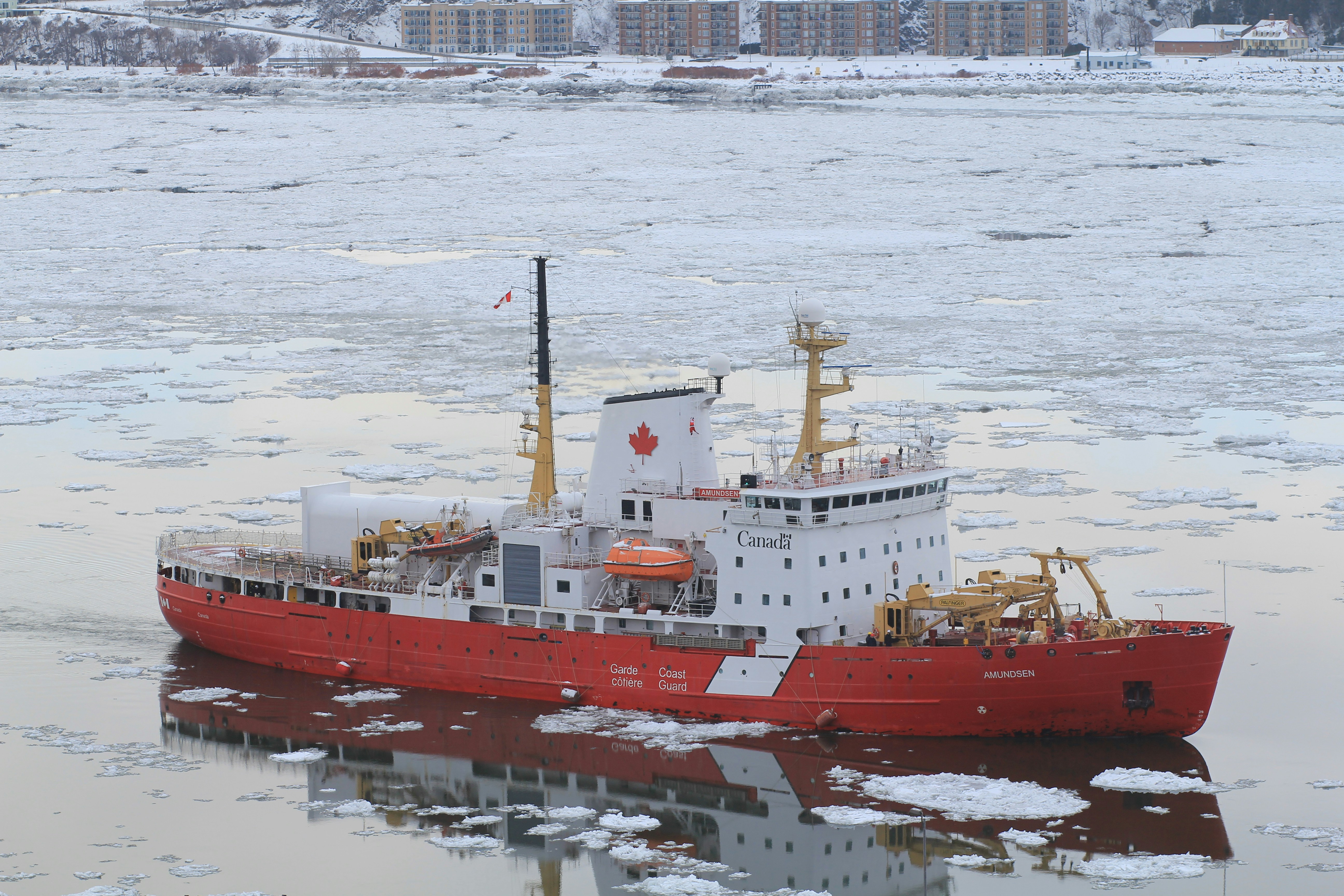 Red Icebreaker Anchored in Fractured Sea