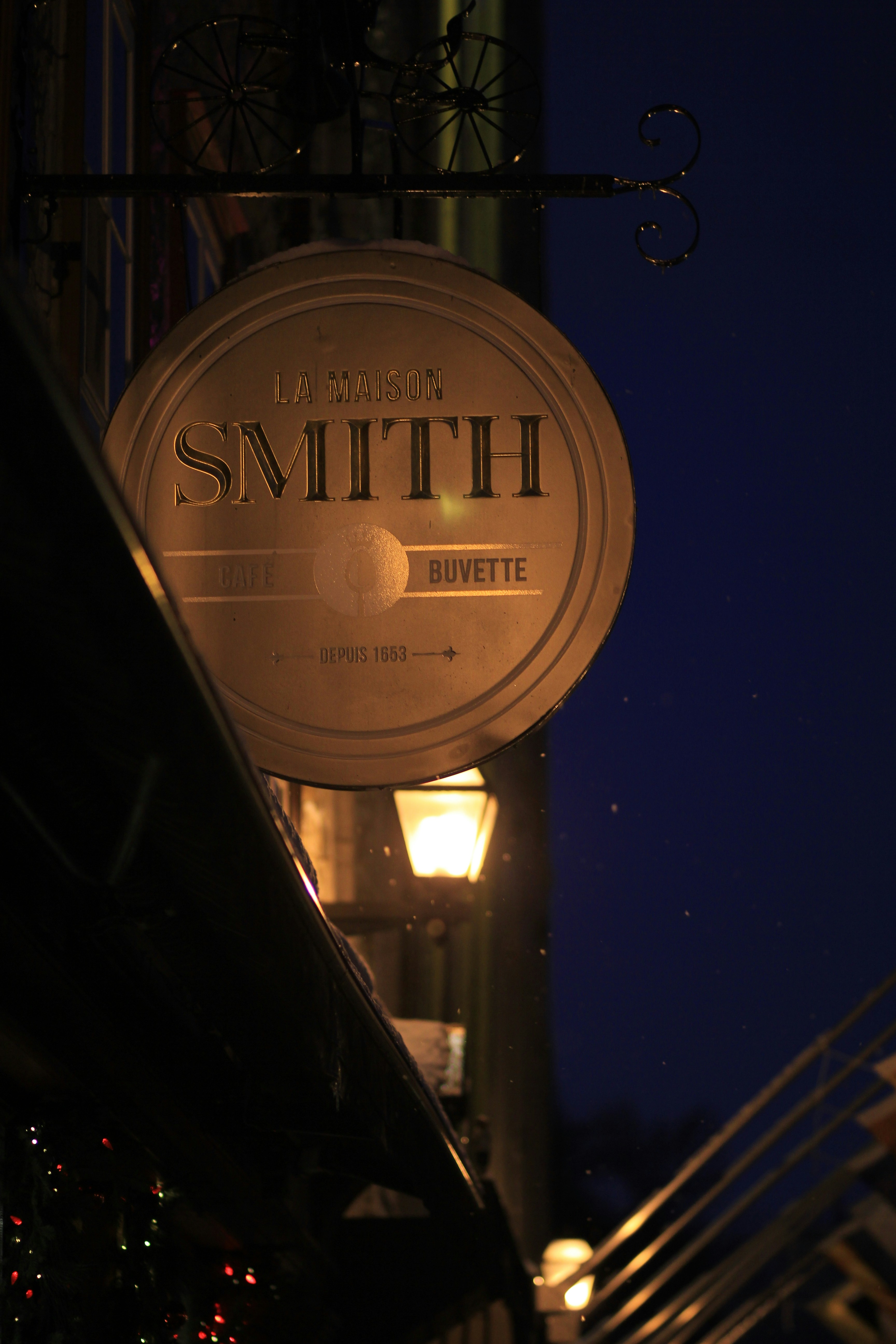 Luminous Signage: Smith's Round Emblem in Night Street Scene