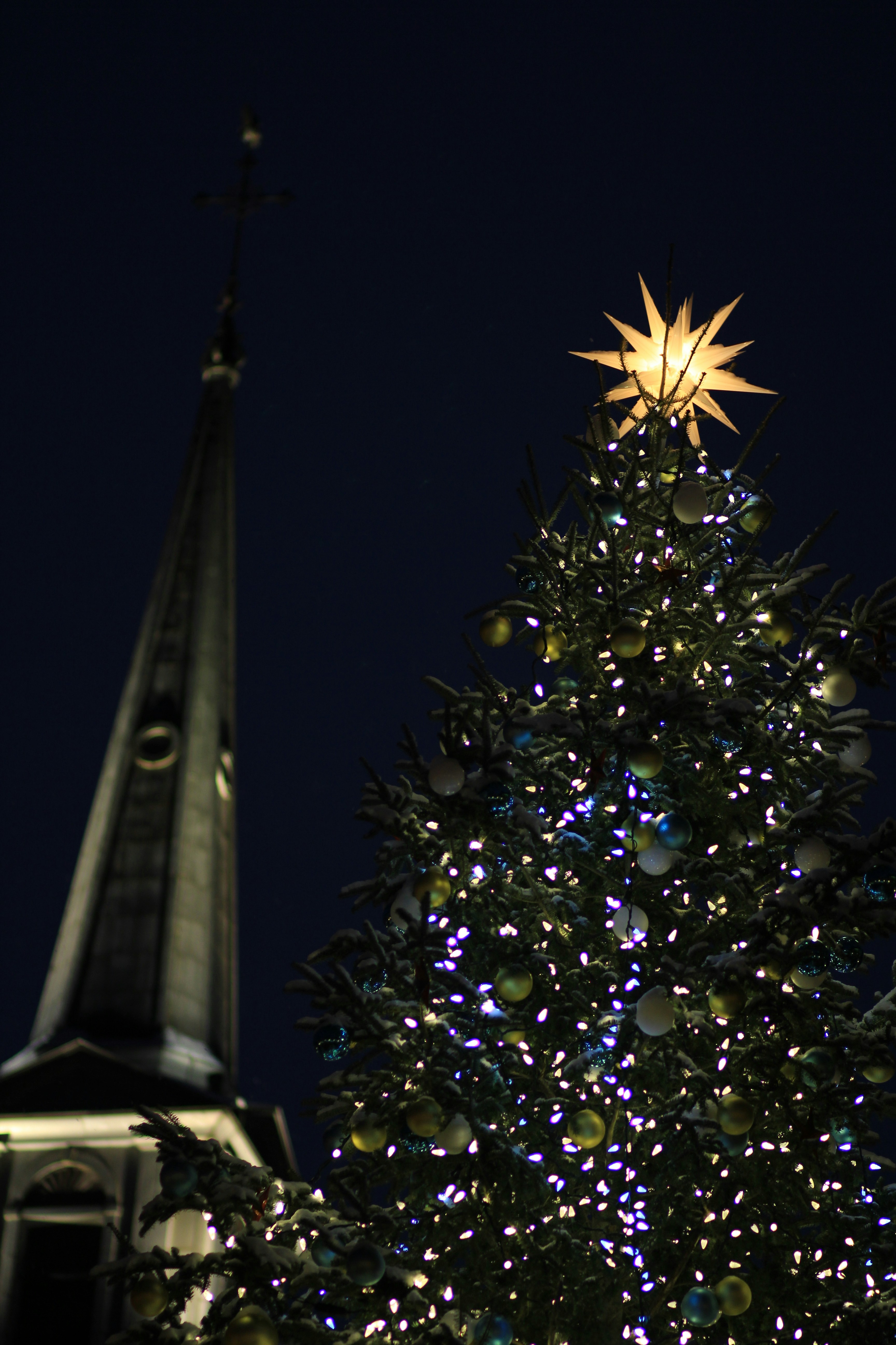 Star atop the Christmas Tree beside the church spire