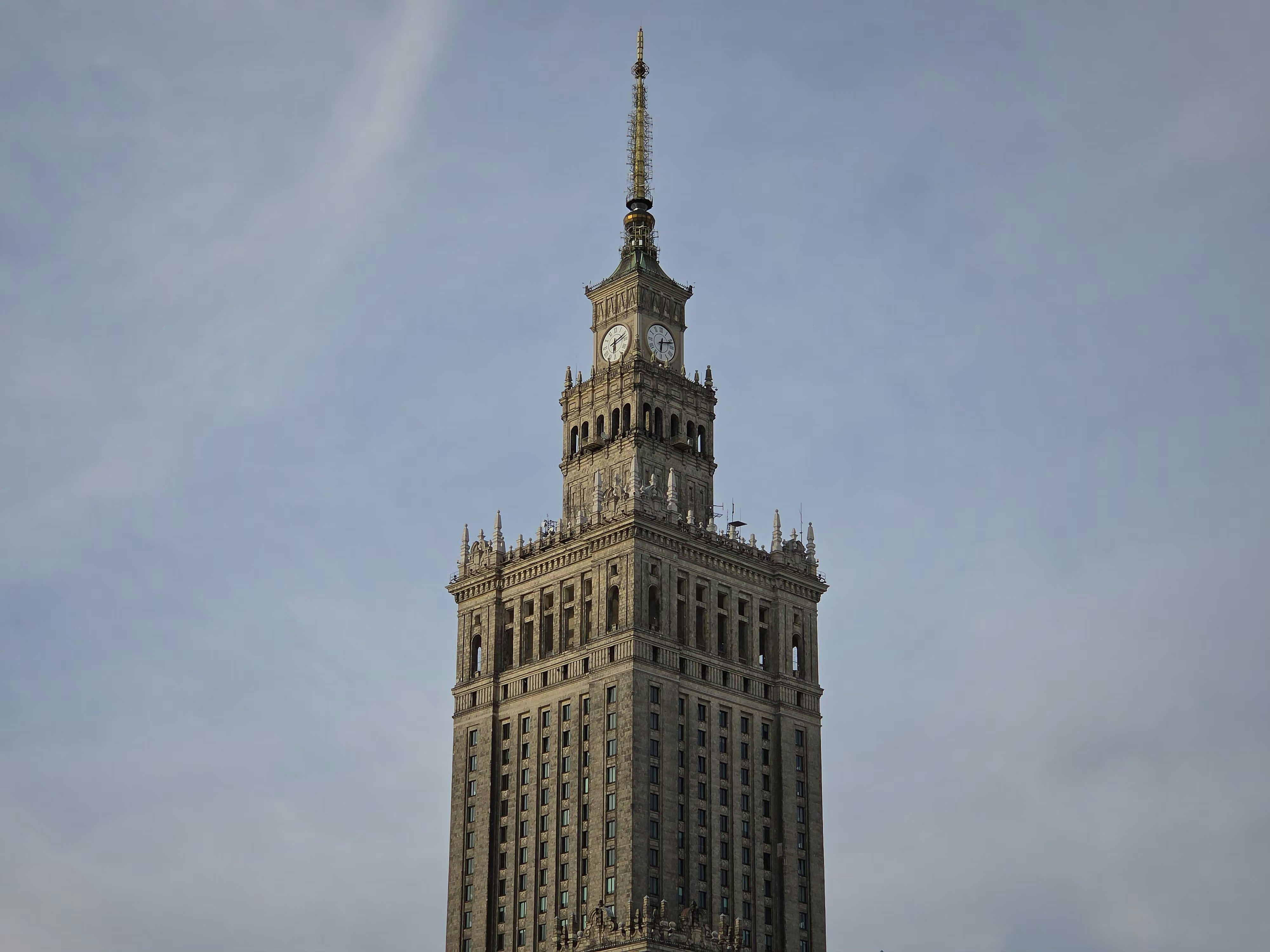 Towering Clock Spire: The Polished Facade of a Historic Minaret
