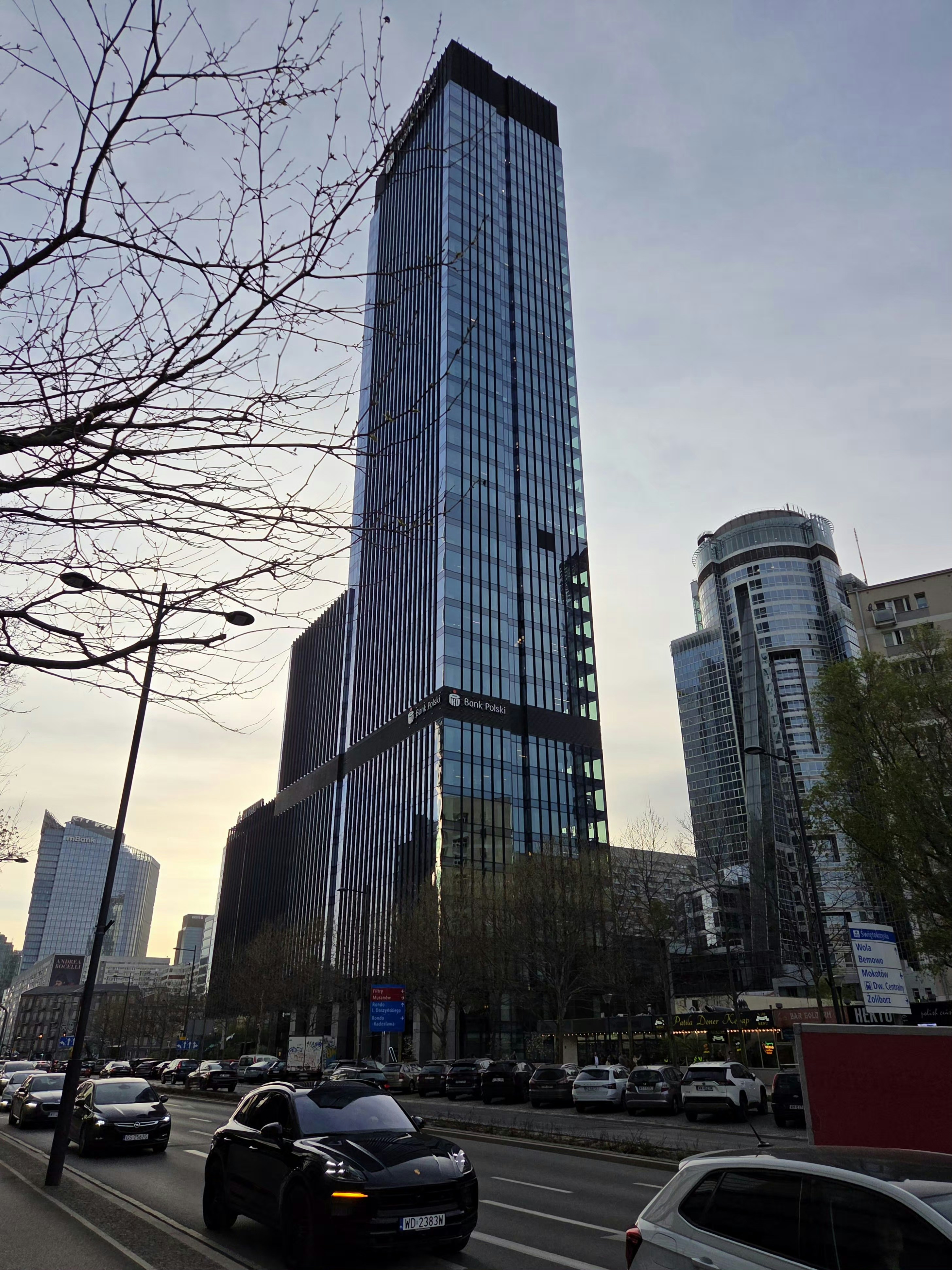 Modern glass skyscraper in a city street