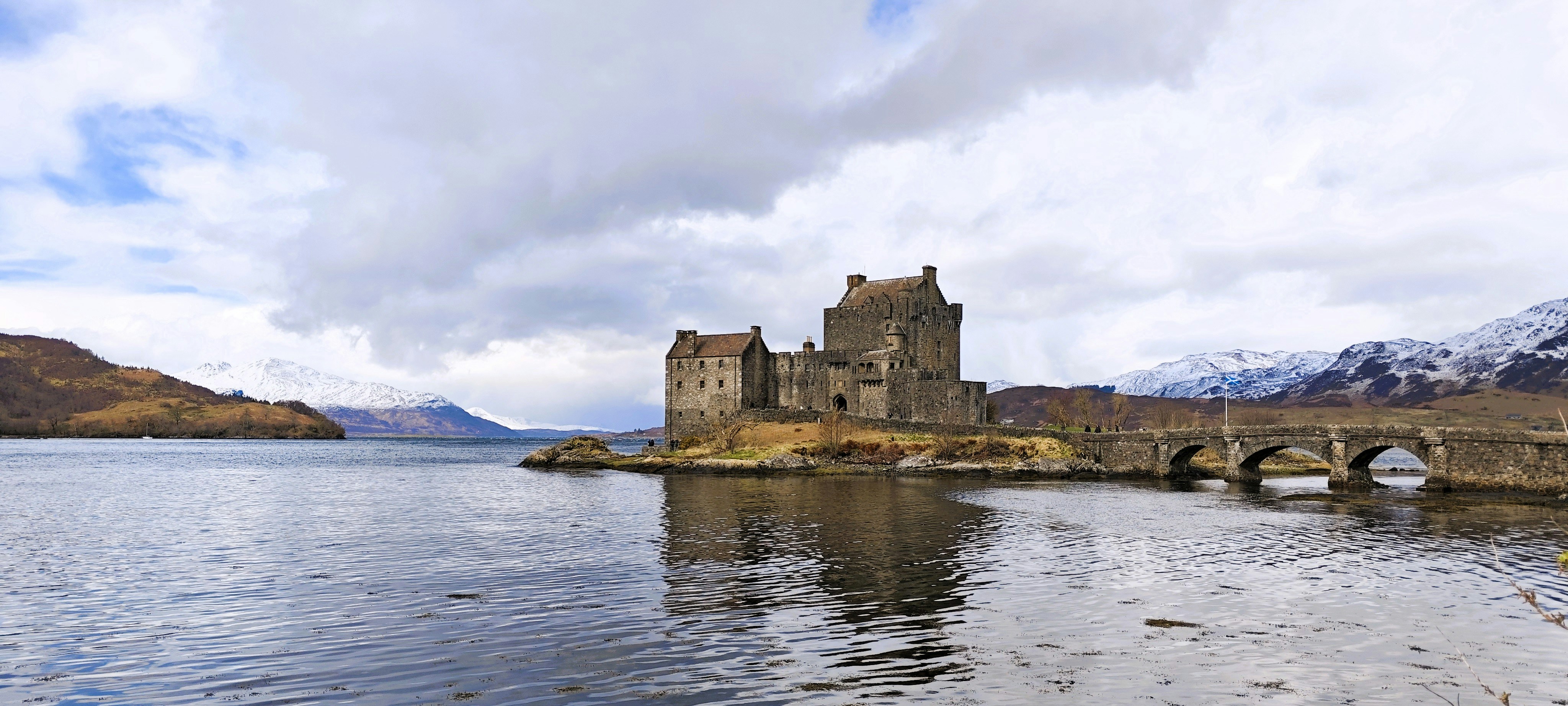 Castle on the Lake: A Sturdy Monolith Guarding the Calm Waters