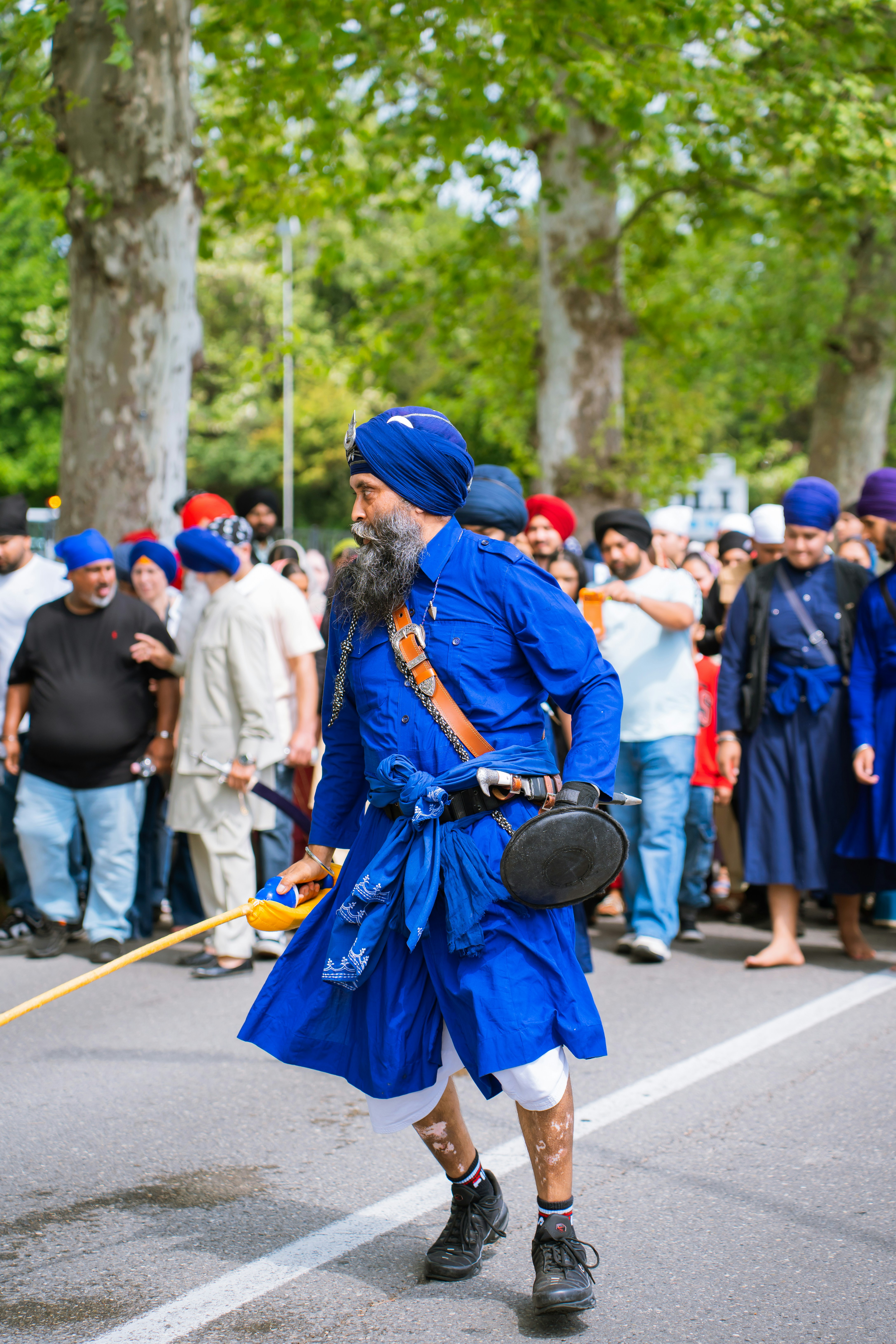 Blue Attire in Motion: A Sikh Warrior Leads the Parade