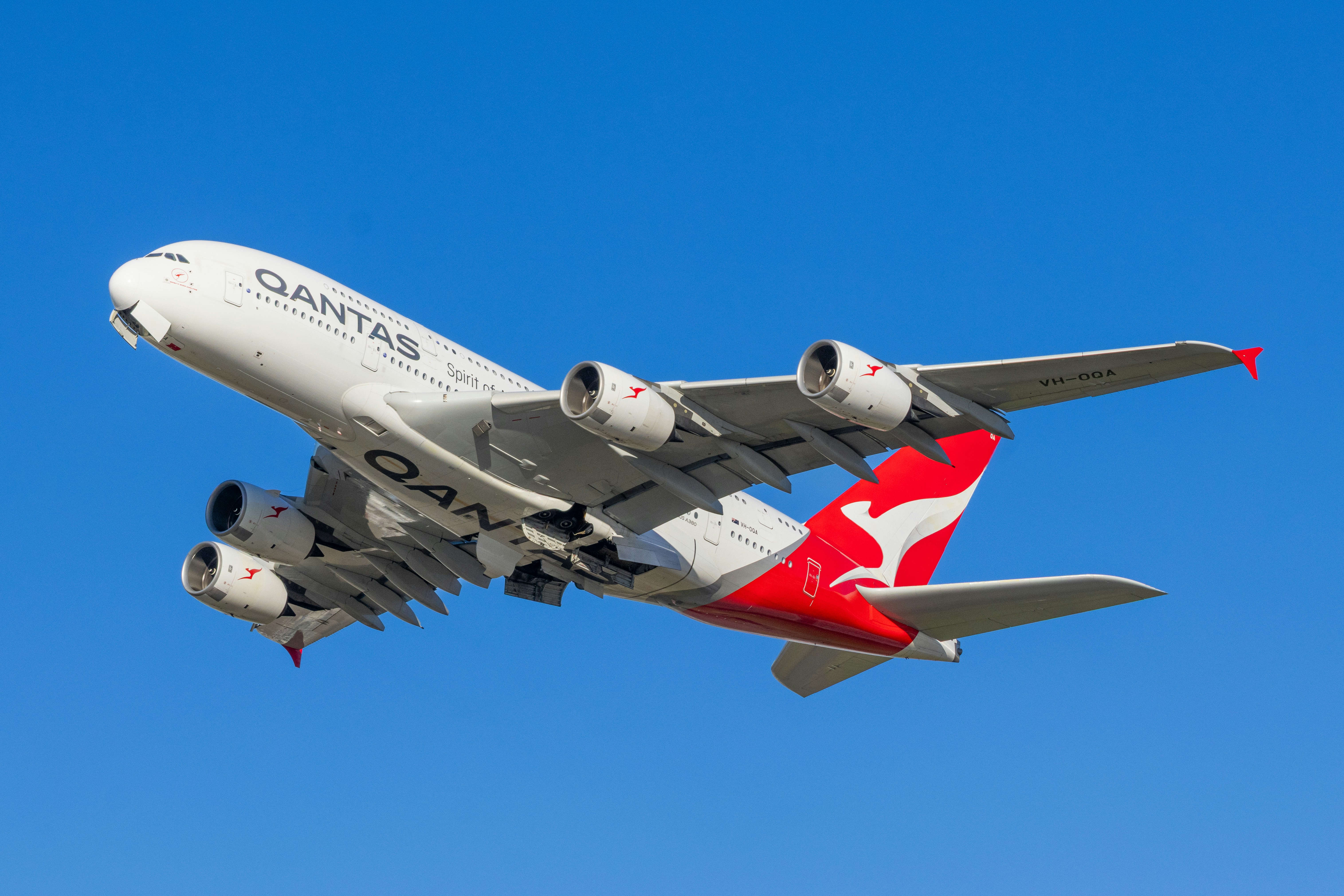 Smooth-Gliding Giant: Qantas A380 Ascends into a Clear Blue
