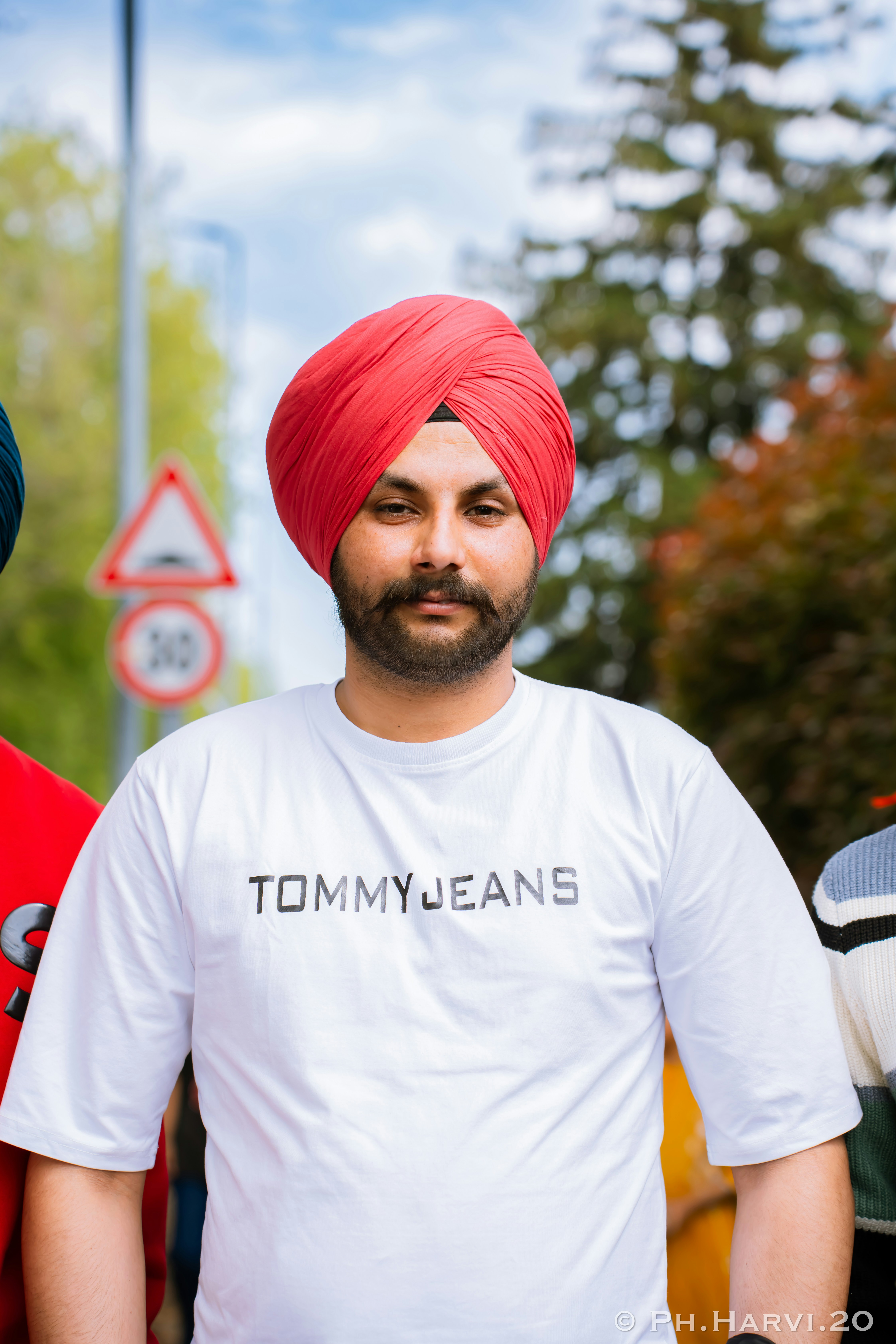Turbaned Confidence: A Portrait in White Tee Under Quiet Street Light