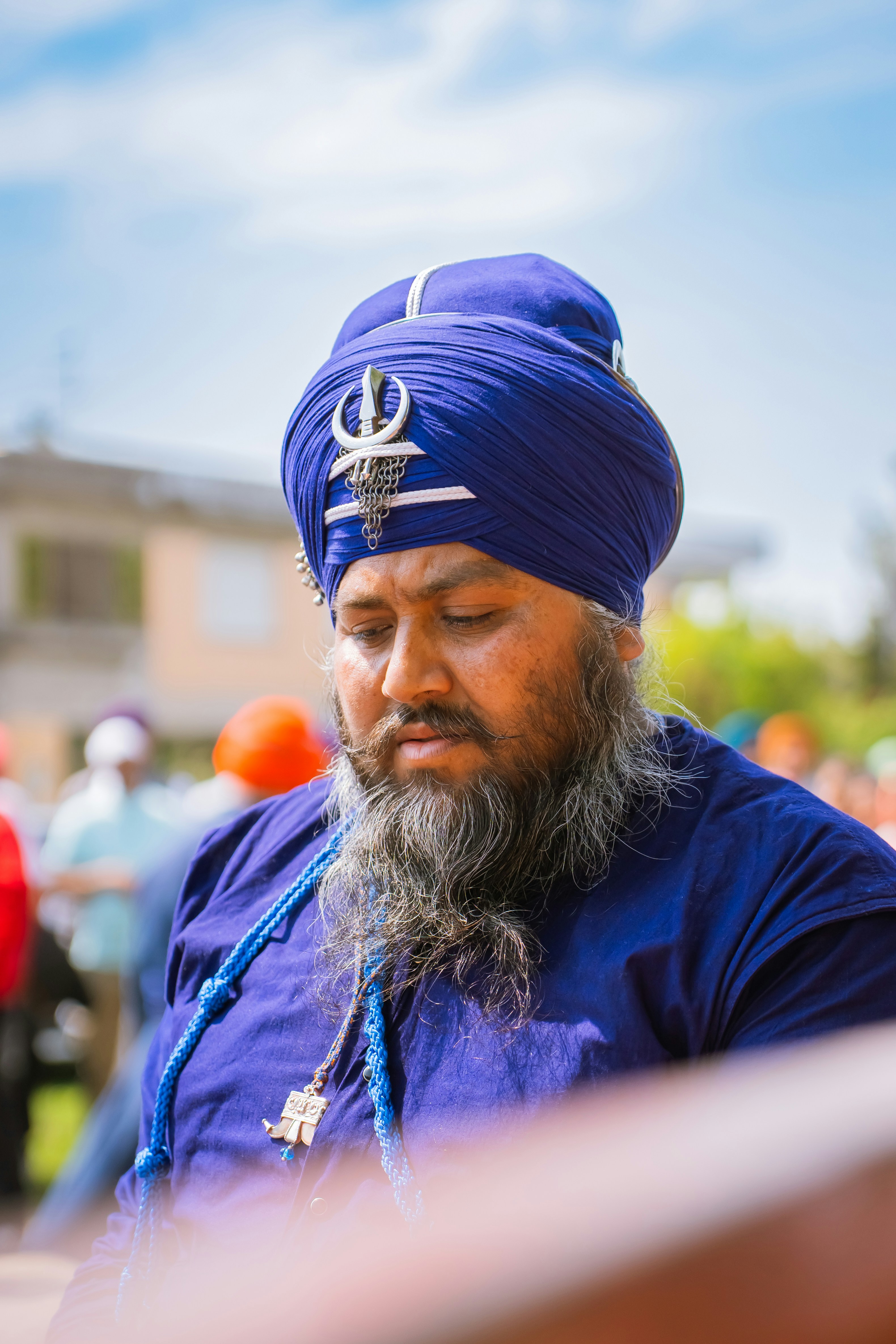 Royal Blue Turban, Quiet Focus: A Portrait in Concentration