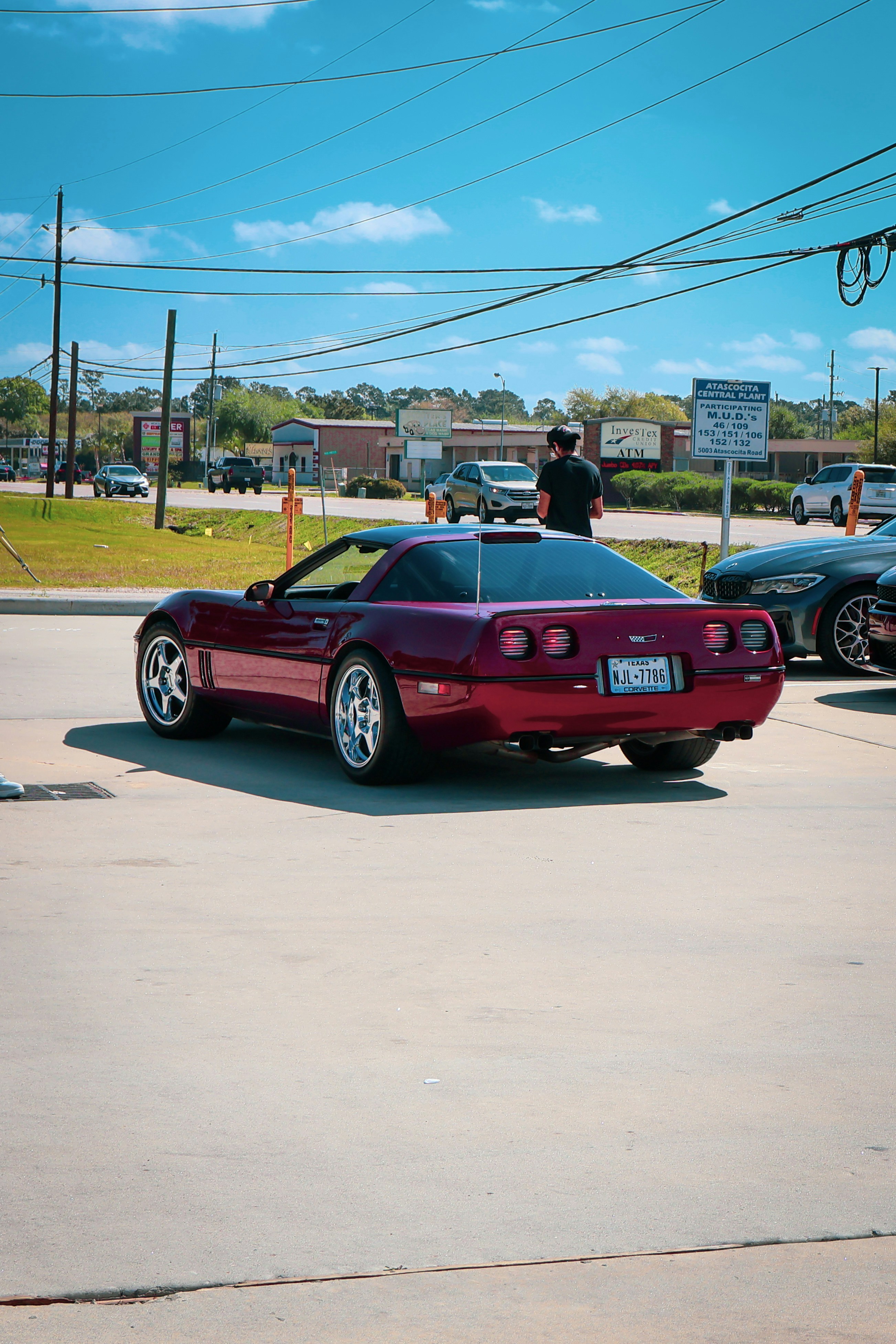 Crimson Convertible at the Edge of Town