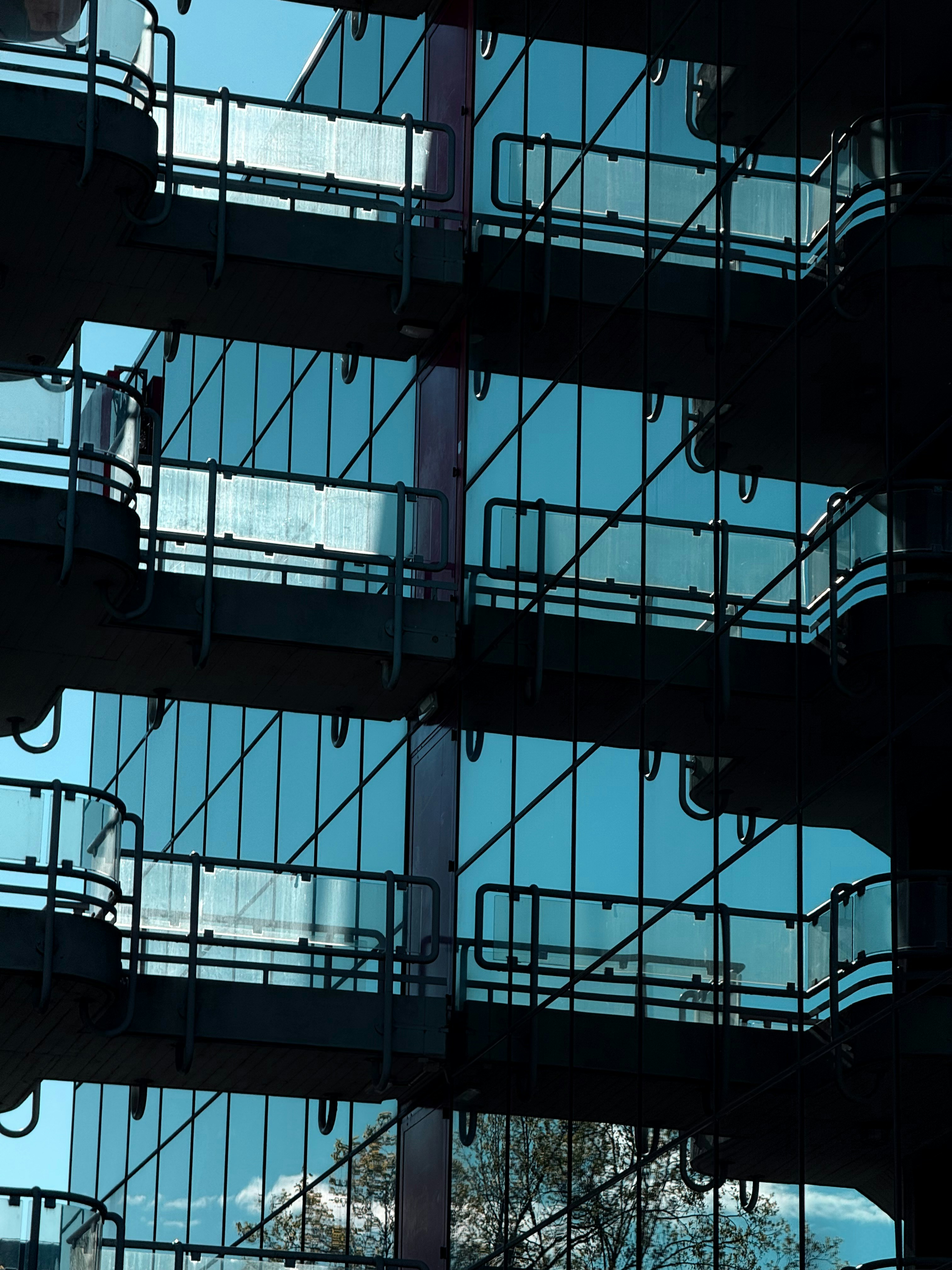 Crisscross of Glass and Shadows Over a Modern Atrium