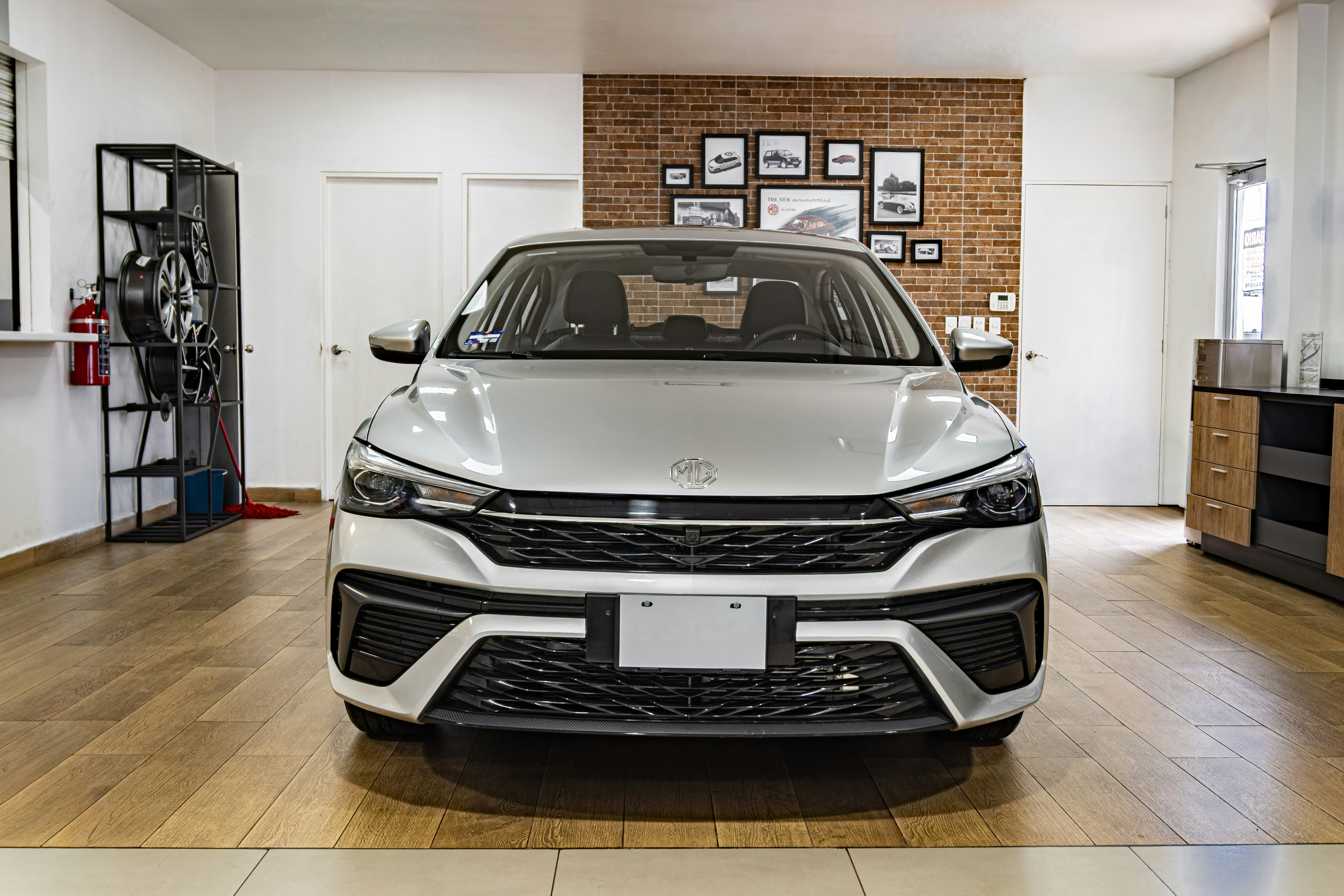 Front-and-Center: A Silver SUV in a Modern Workshop Studio