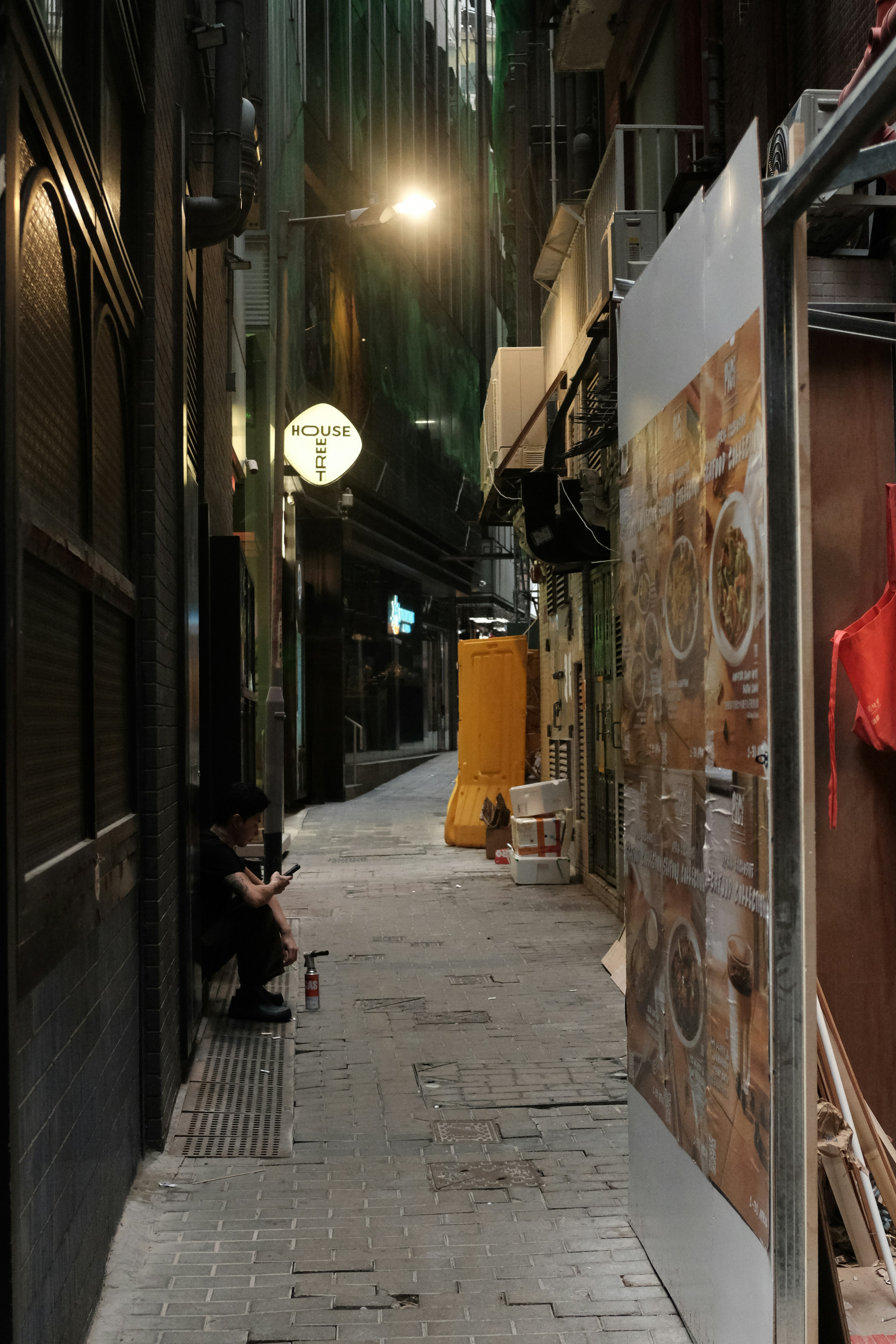 Neon Alley Pulse: Quiet Figure in a City Narrow