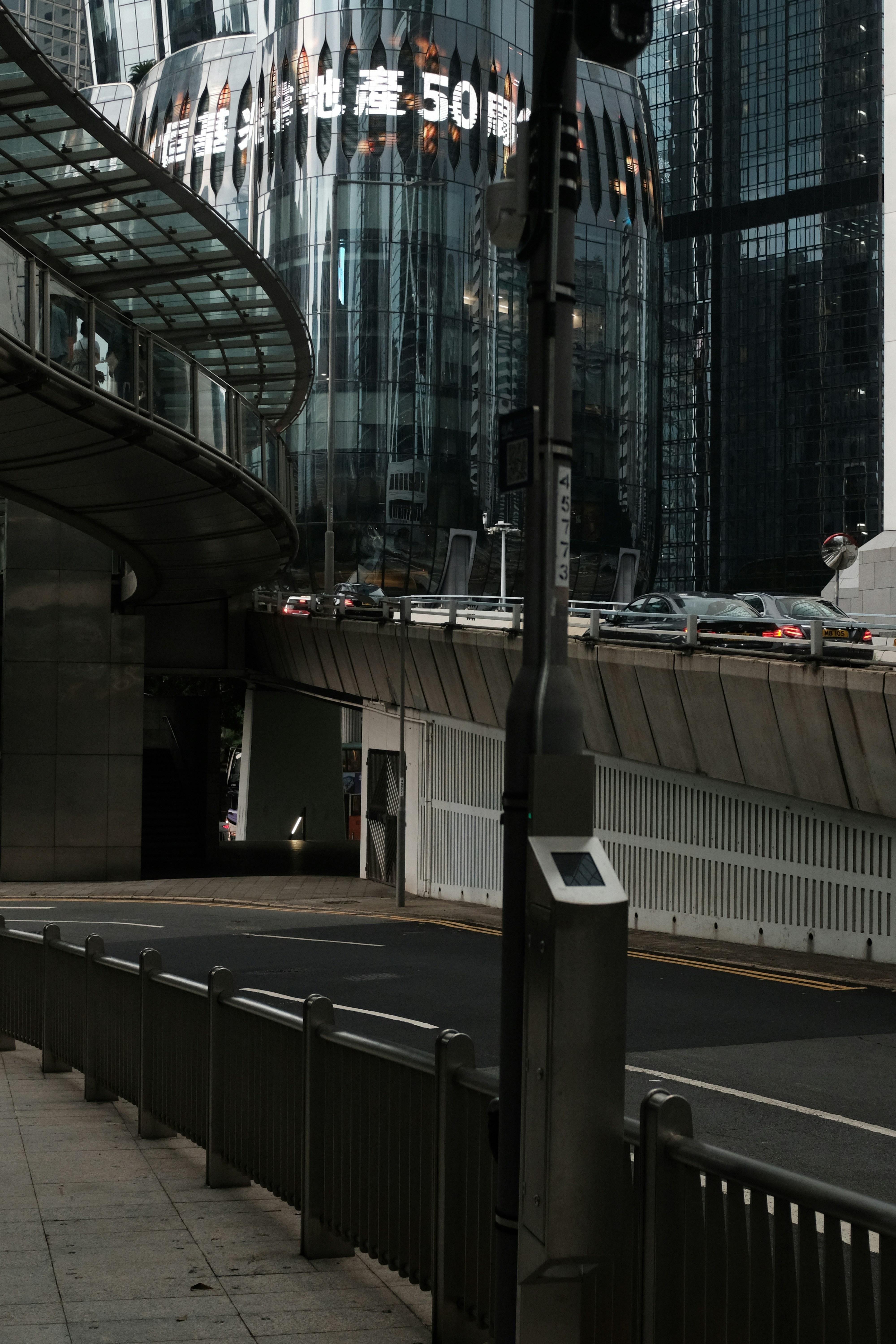 Glass Tower Arc: Neon Reflections Over an Urban Ramp