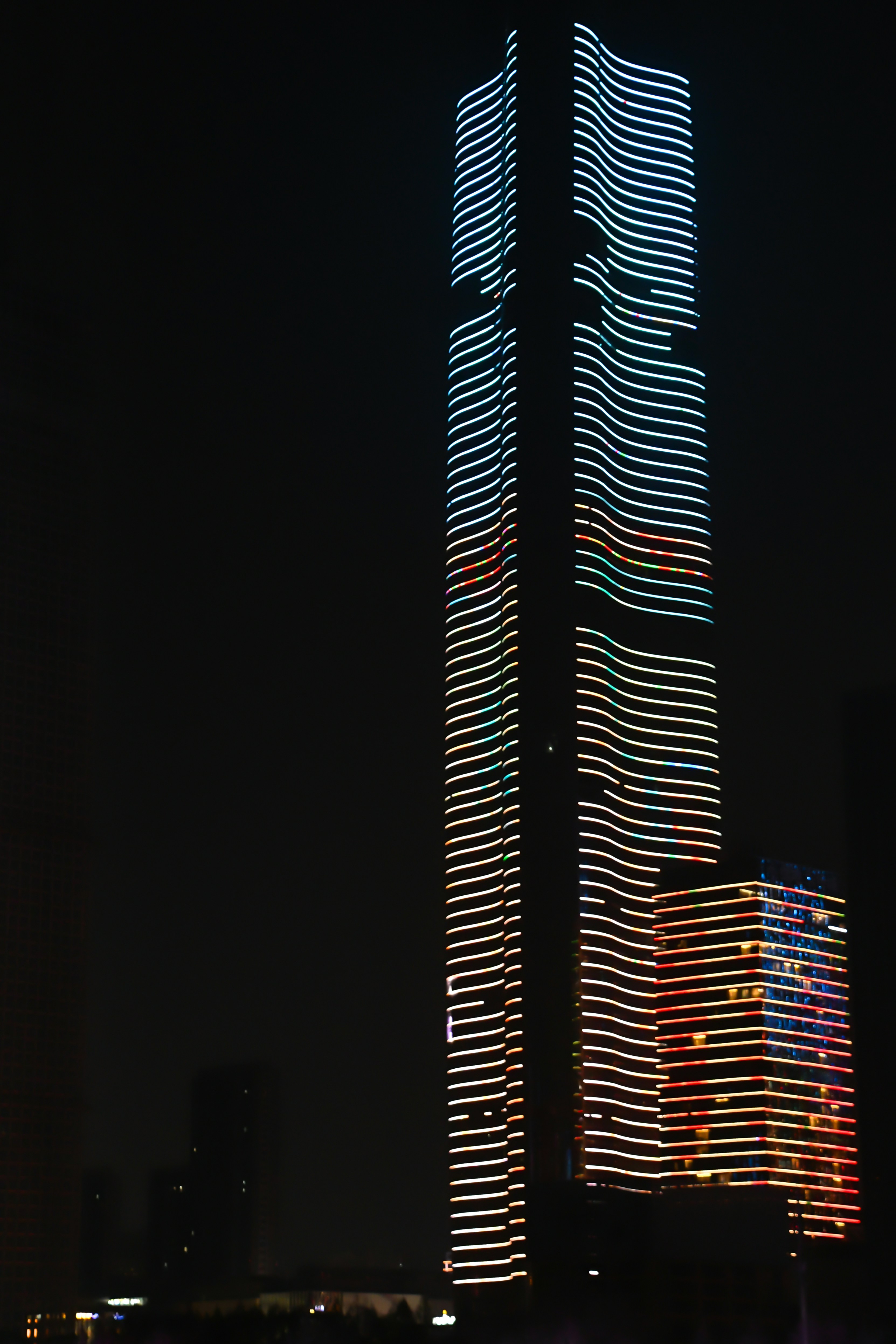 Neon Spiral: Nighttime Twin Tower Ribbons