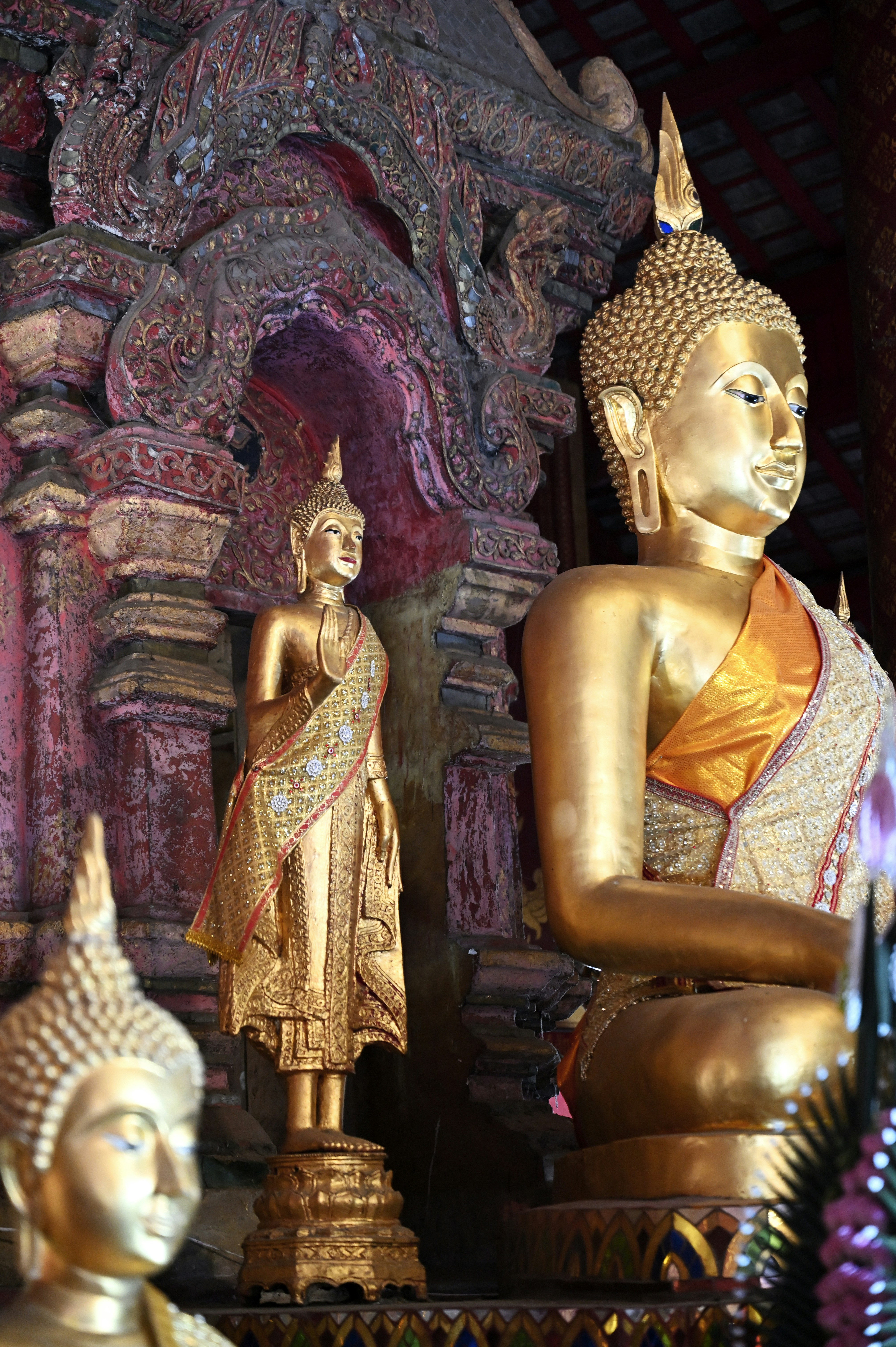 Golden Buddhas in a Sacred Temple Niche