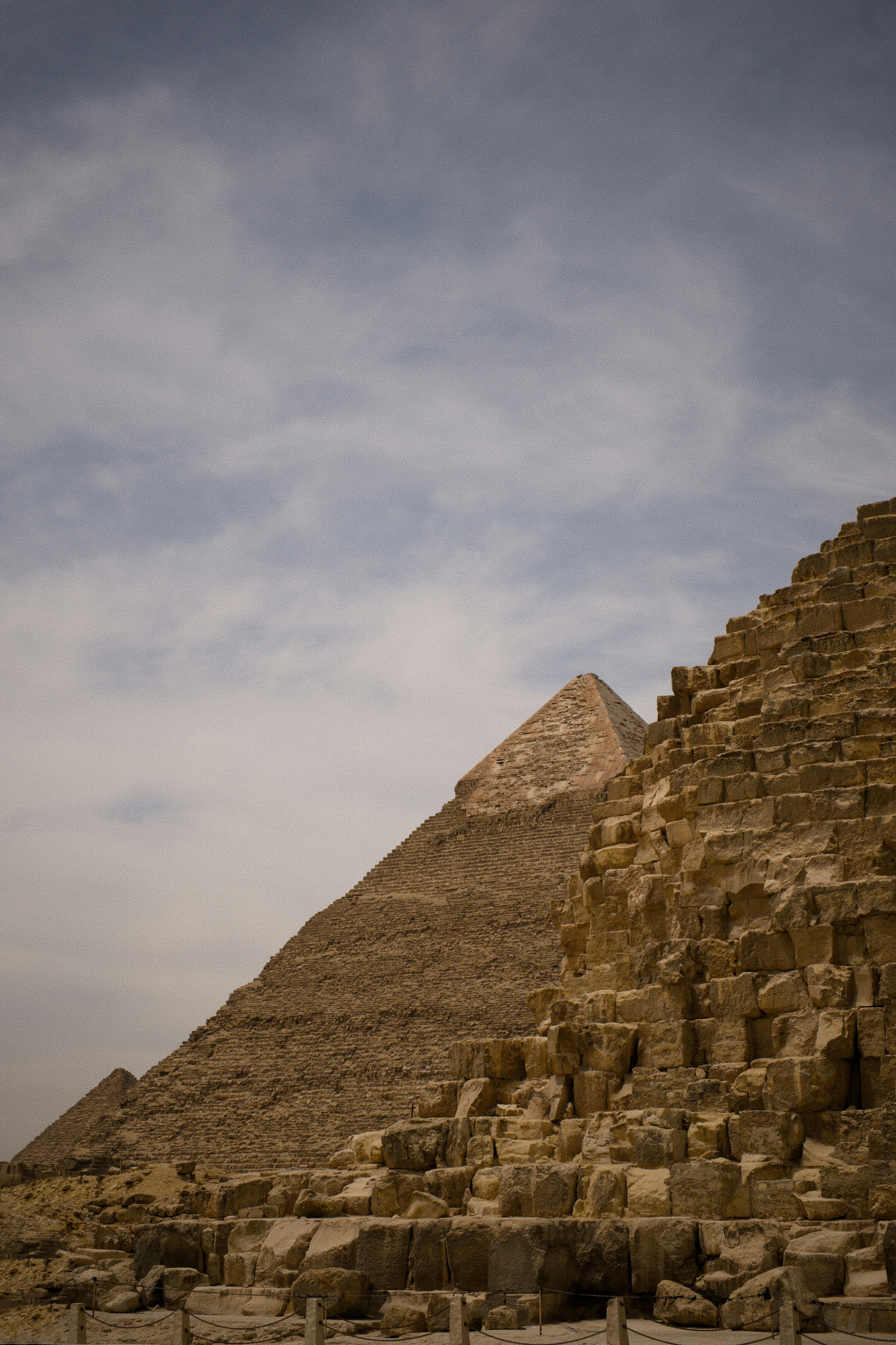 Ancient Steps: The Giza Pyramids Rising Over Desert Morning