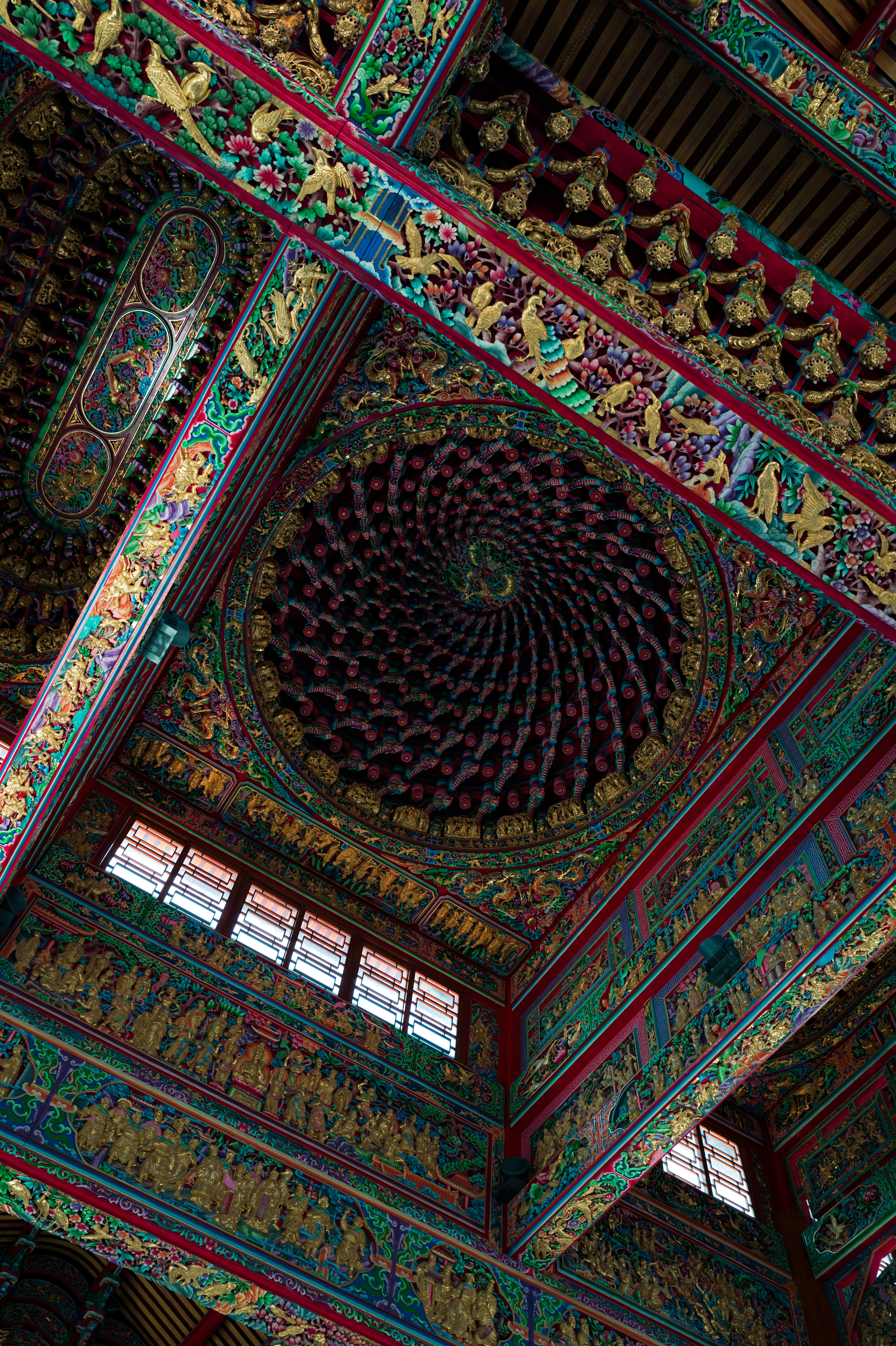 Celestial Spiral: a kaleidoscope ceiling of color and carved figures