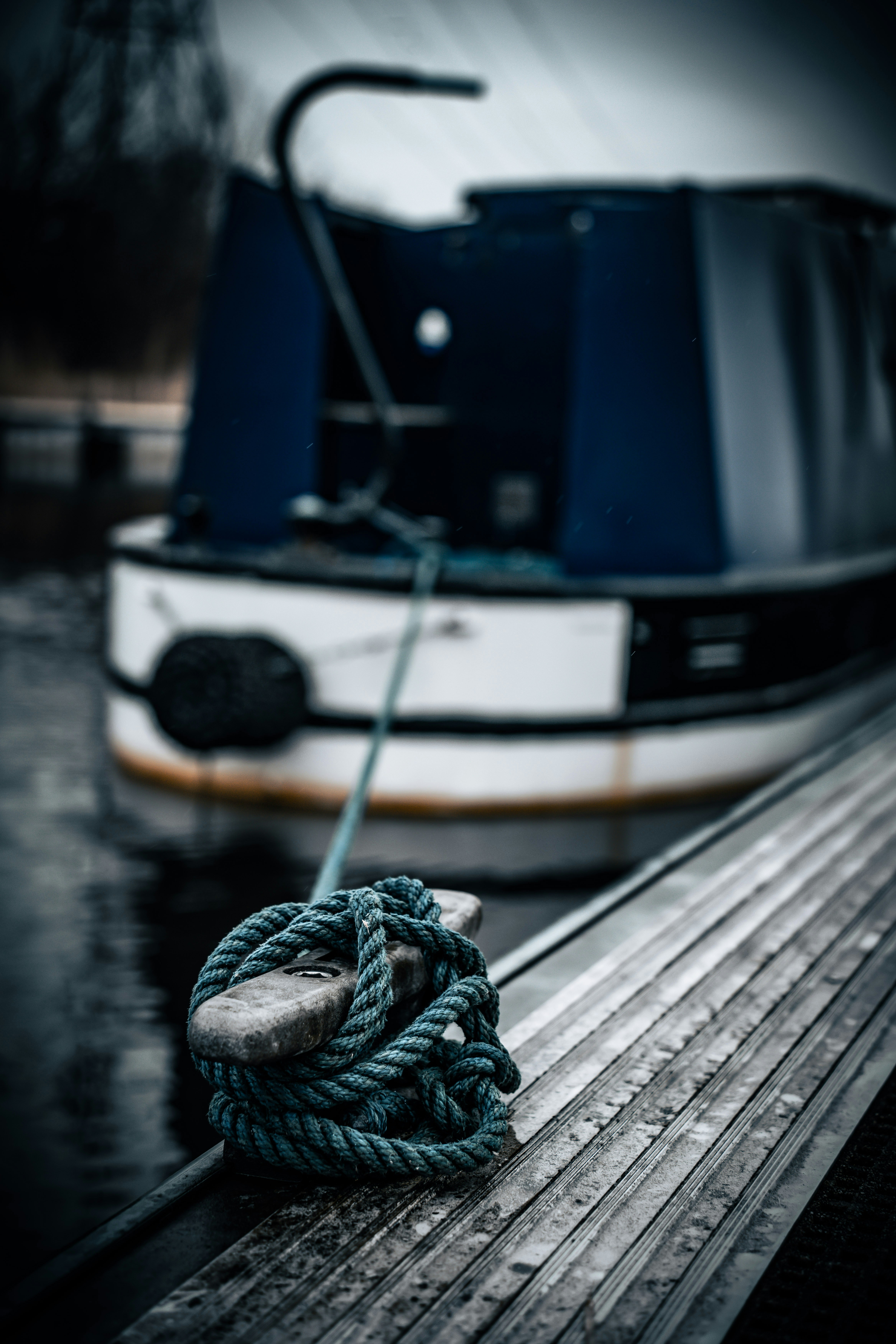 Rope and Tugboat: A Close-Up on Wet Banklines