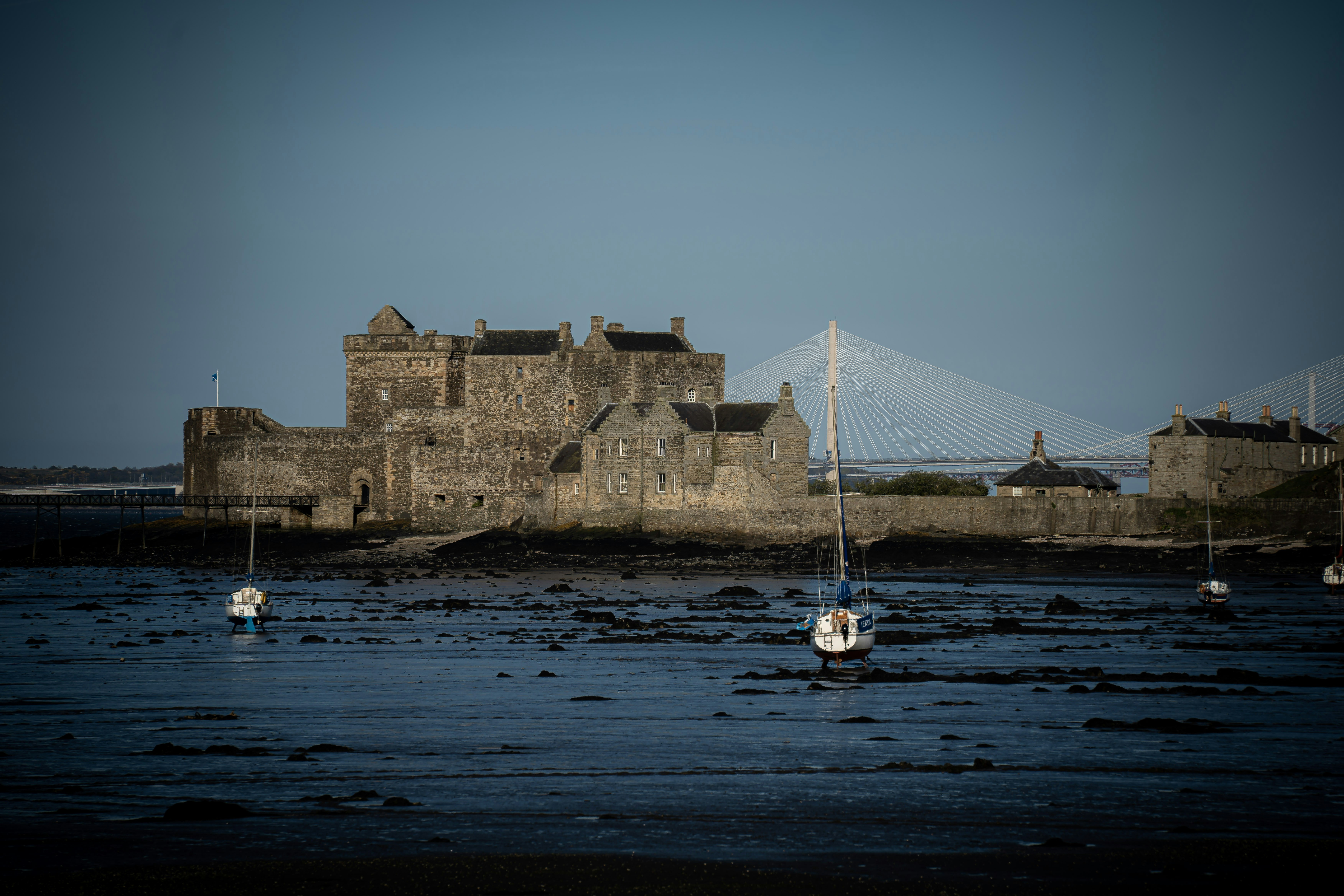 Castle by the Tide: A Quiet Coastal Fortress under Blue Skies