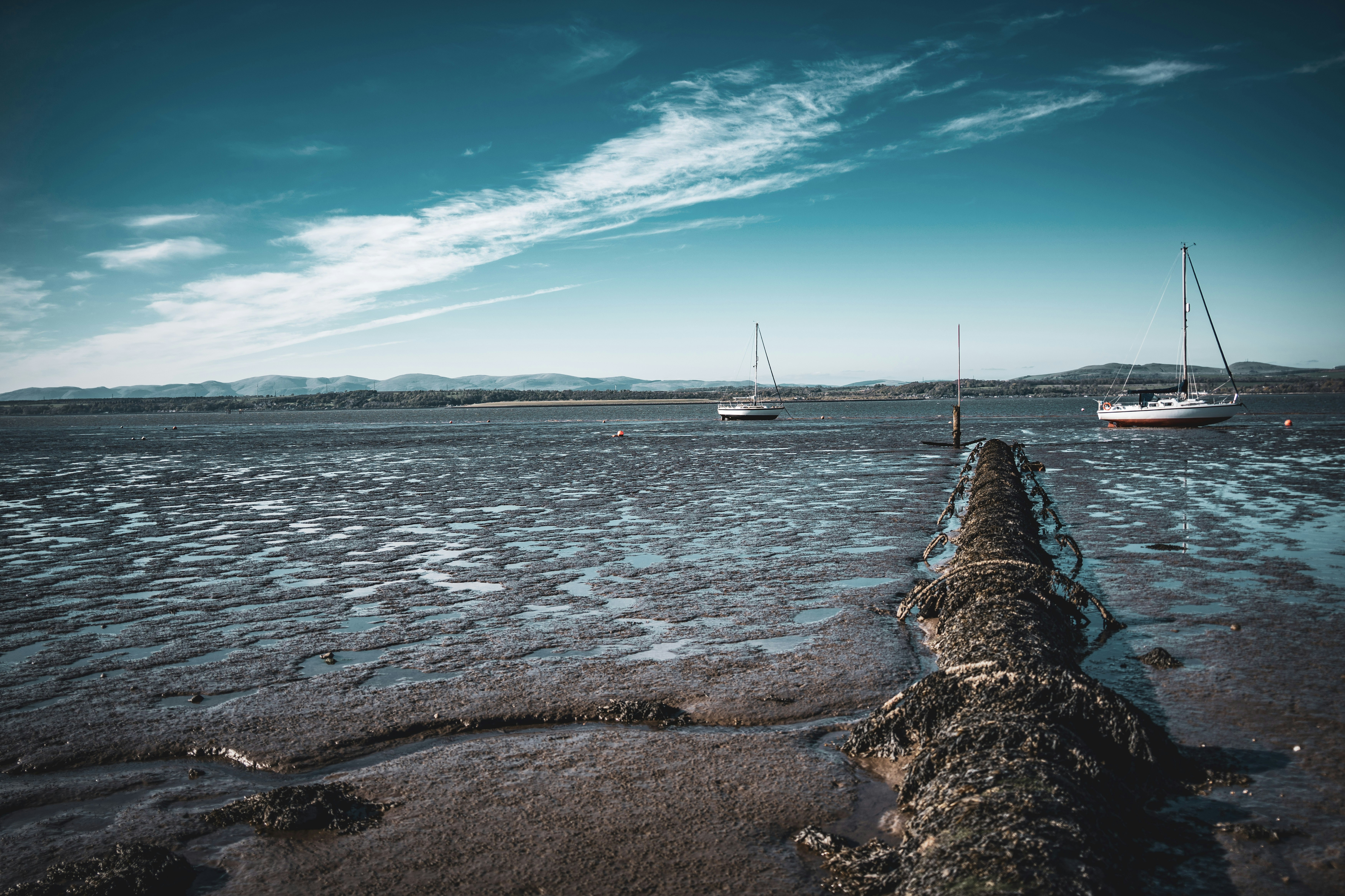 Tide-Worn Breakwater Framing a Quiet Harbor
