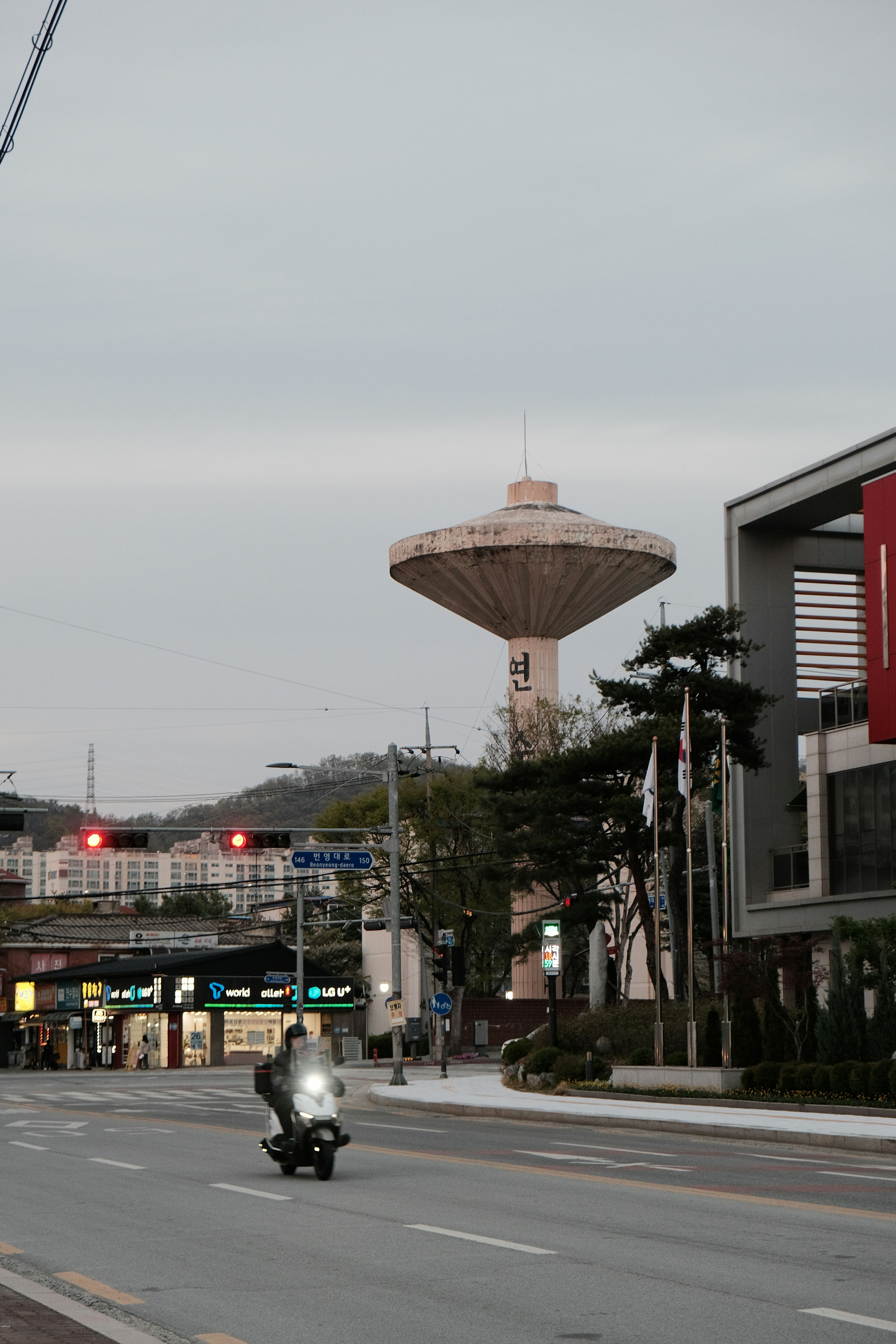 Urban Landmark: The Water Tower Rising Above a Quiet Street