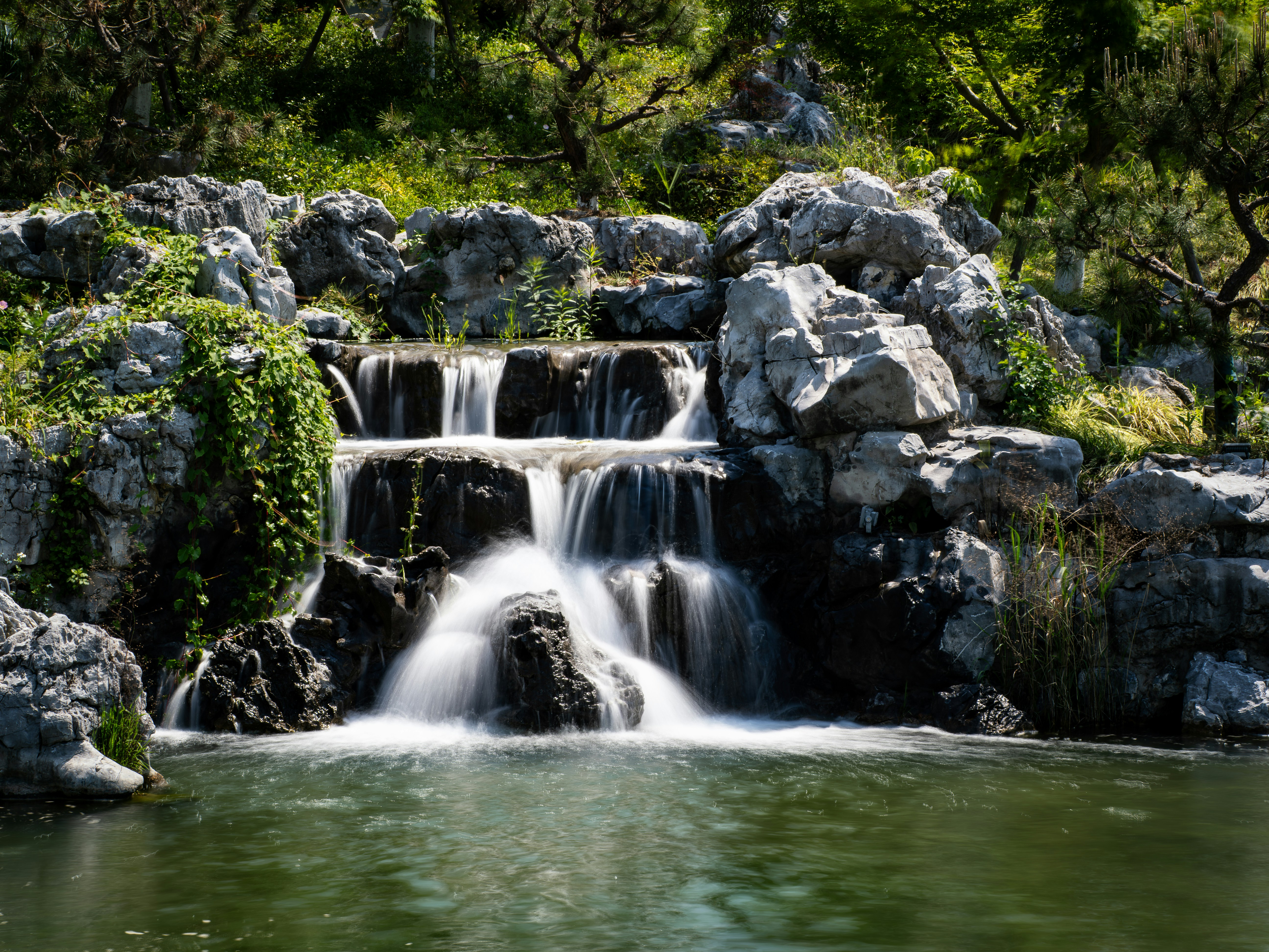 Whispering Falls: A Quiet Cascade Between Weathered Stones