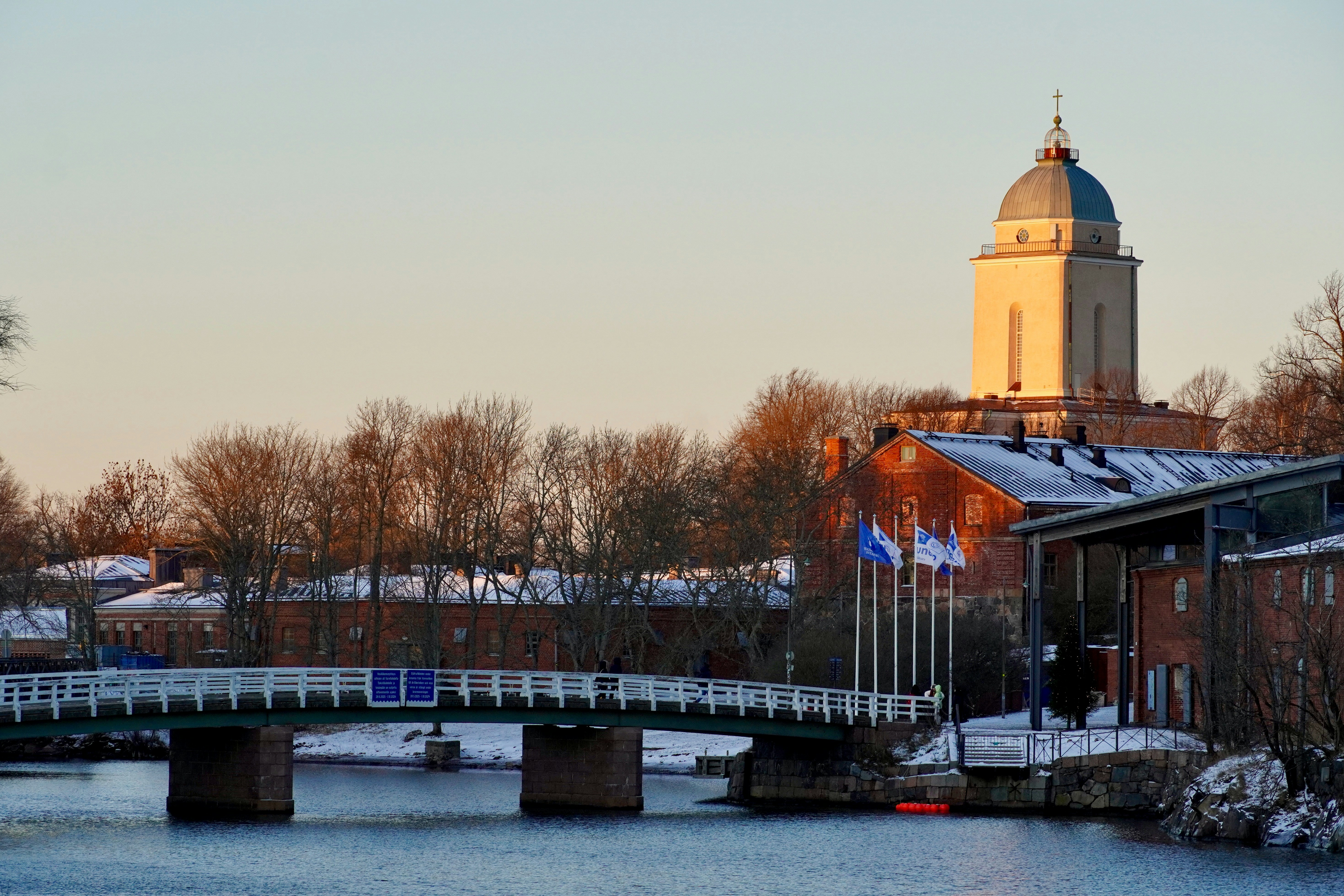 Bridge, Church, and Winter Light: A Riverside Town at Dusk