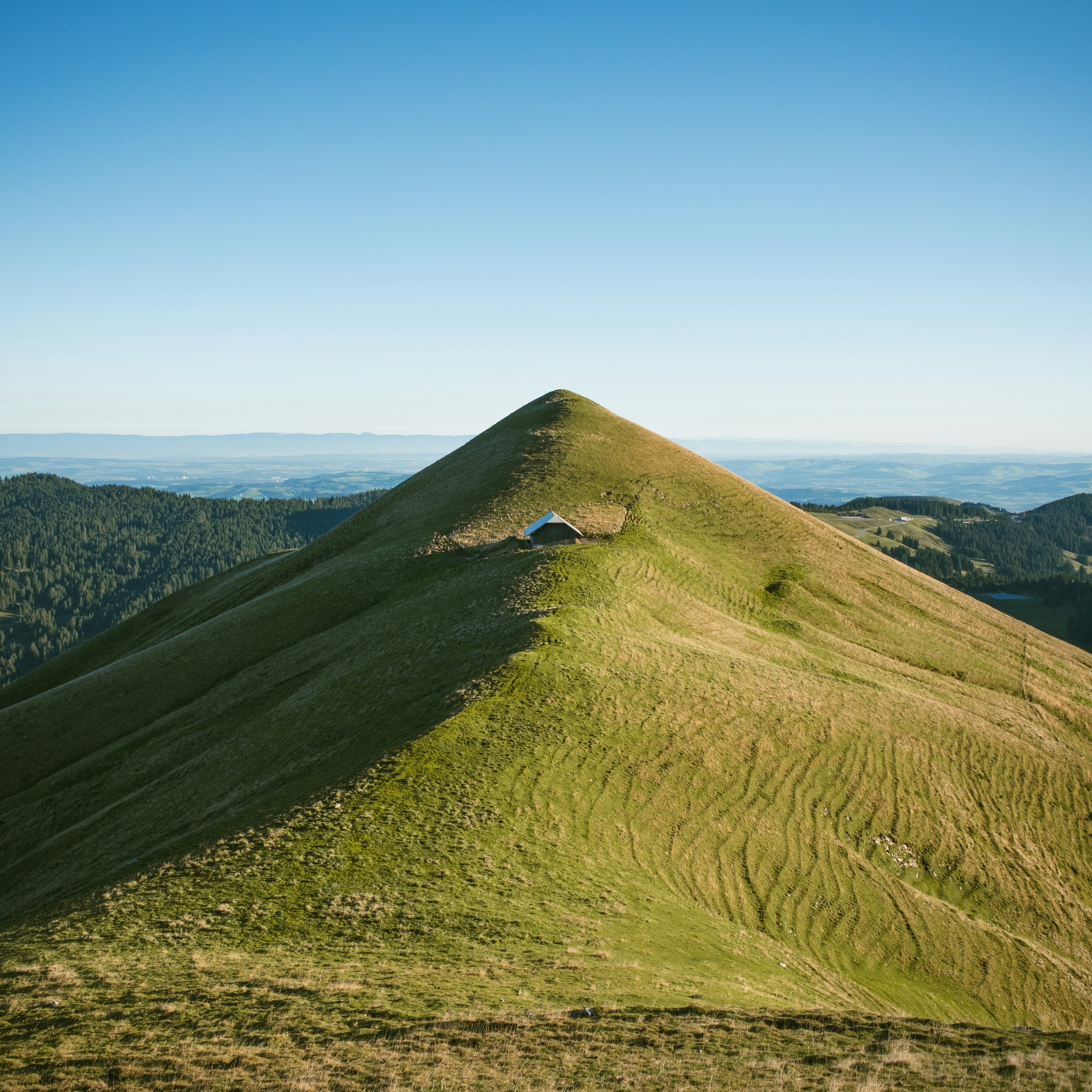 The Lone Peak: A Gentle Summit Under Clear Skies