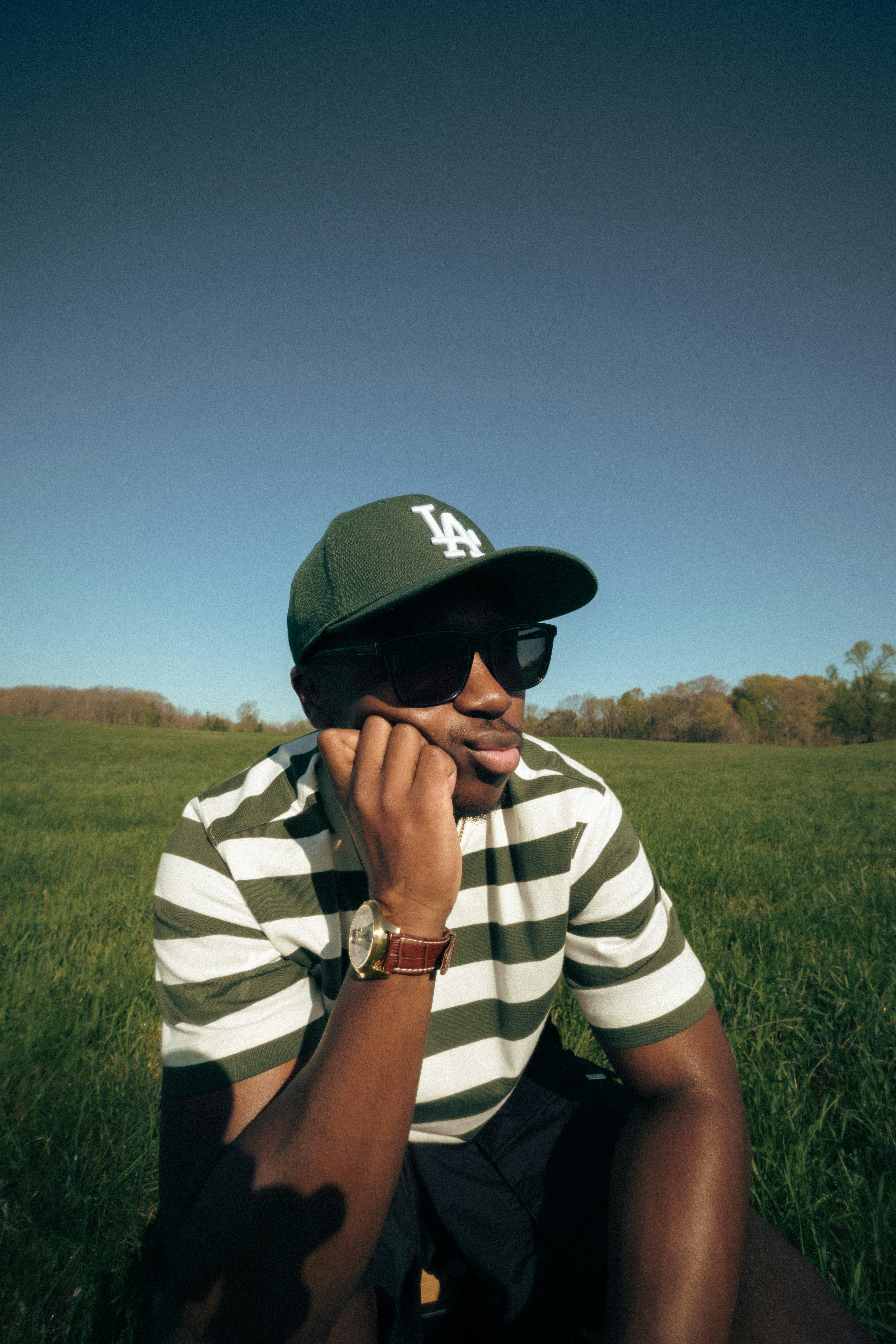 Sunlit Selfie in the Field: Caps, Stripes, and Shade